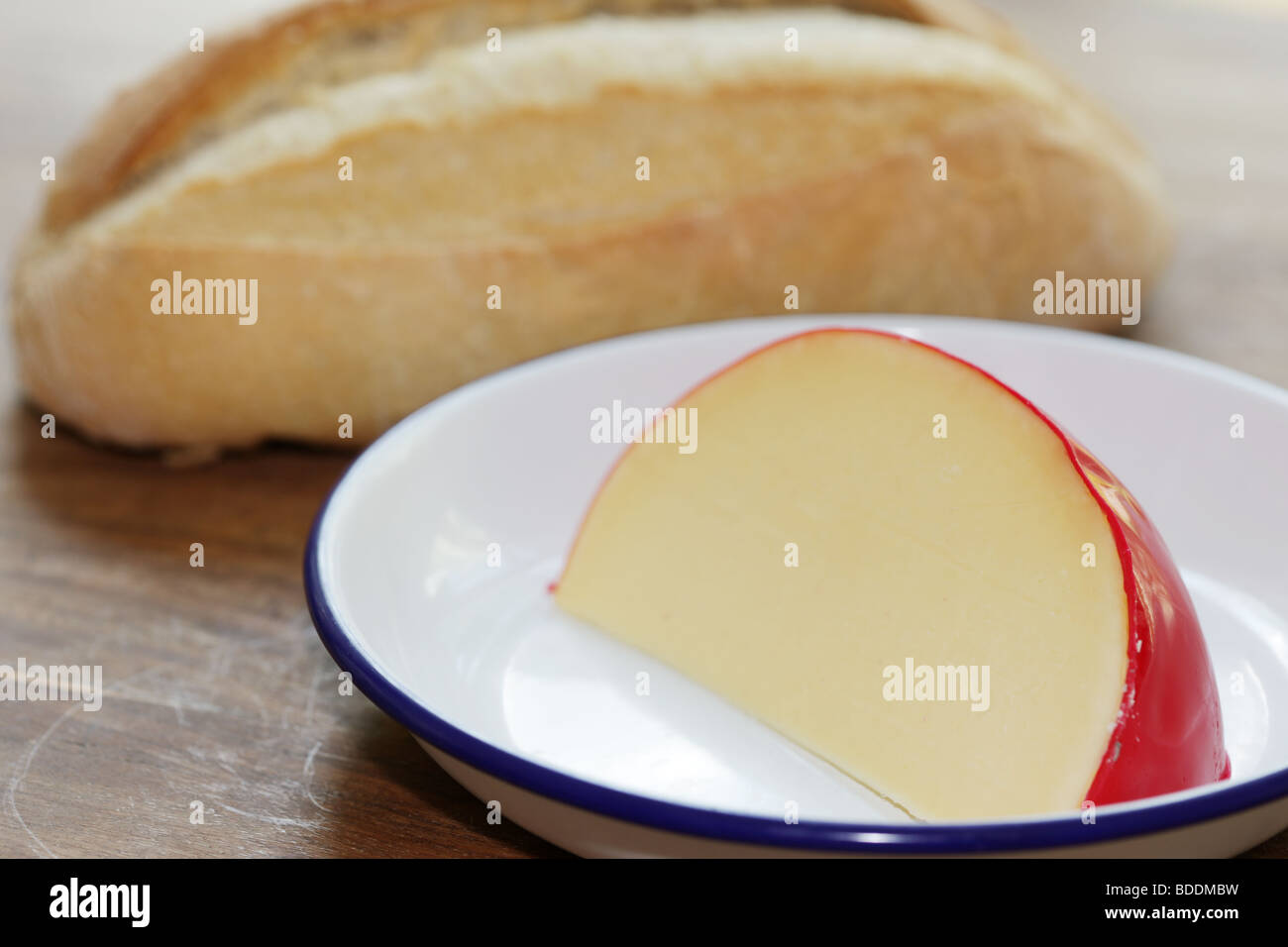 Lump of Edam Cheese with a Bread Roll Stock Photo - Alamy