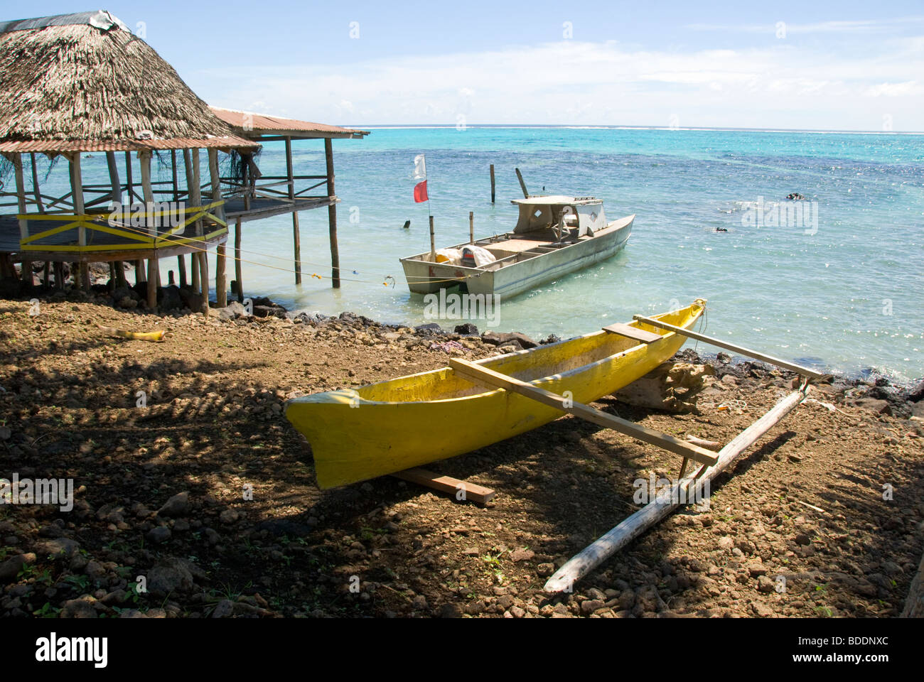 Outrigger canoe and aluminum fishing boat by beach, Savai'i, Western ...