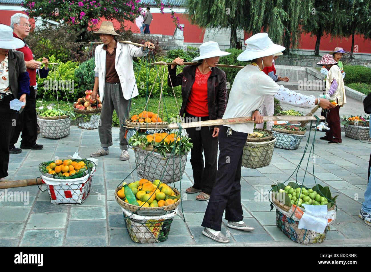 China, Yunnan, Dali City, mango sellers Stock Photo - Alamy