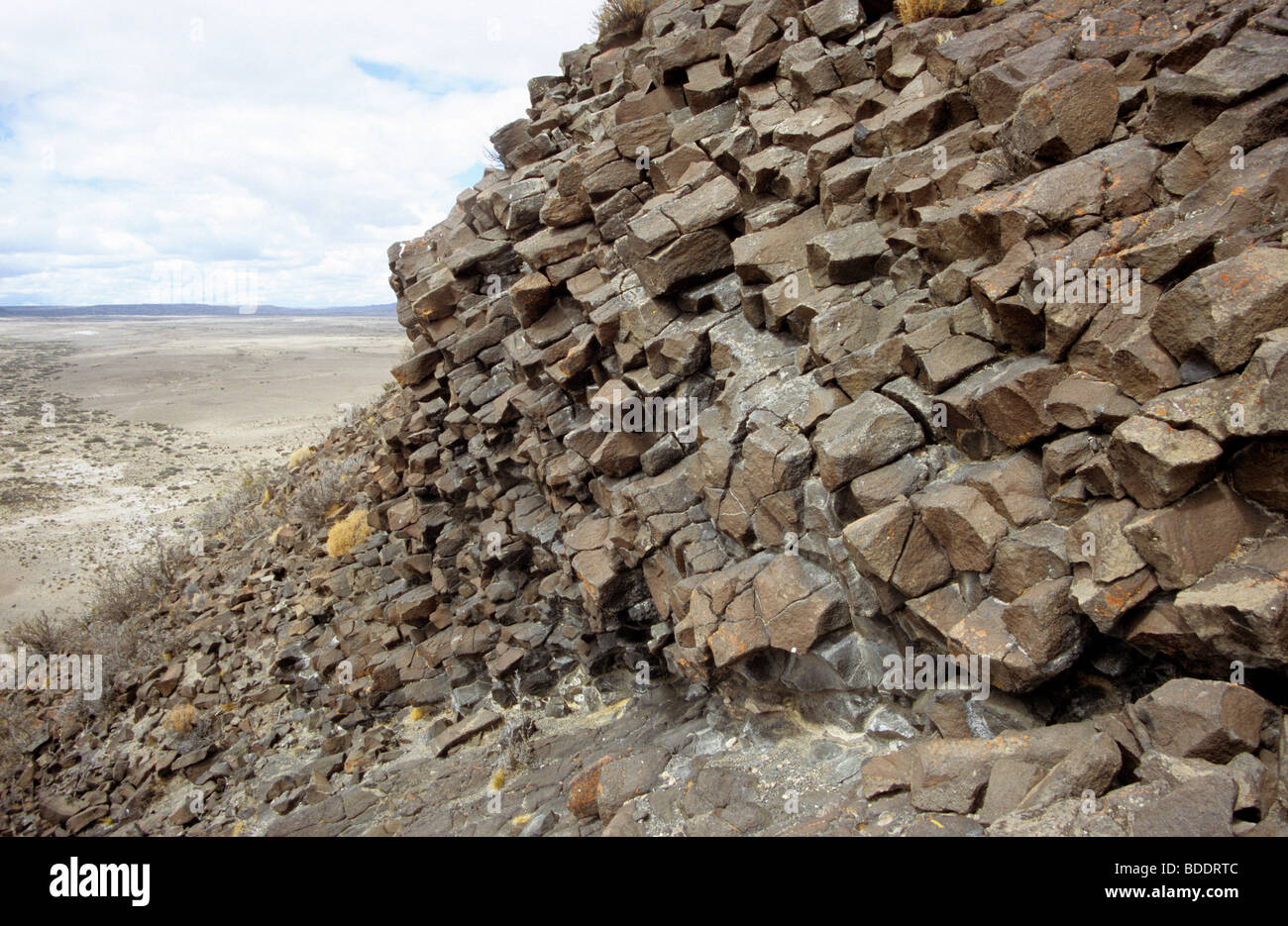 Ancient volcanic columns on hilltop in The vast open remote plains of ...