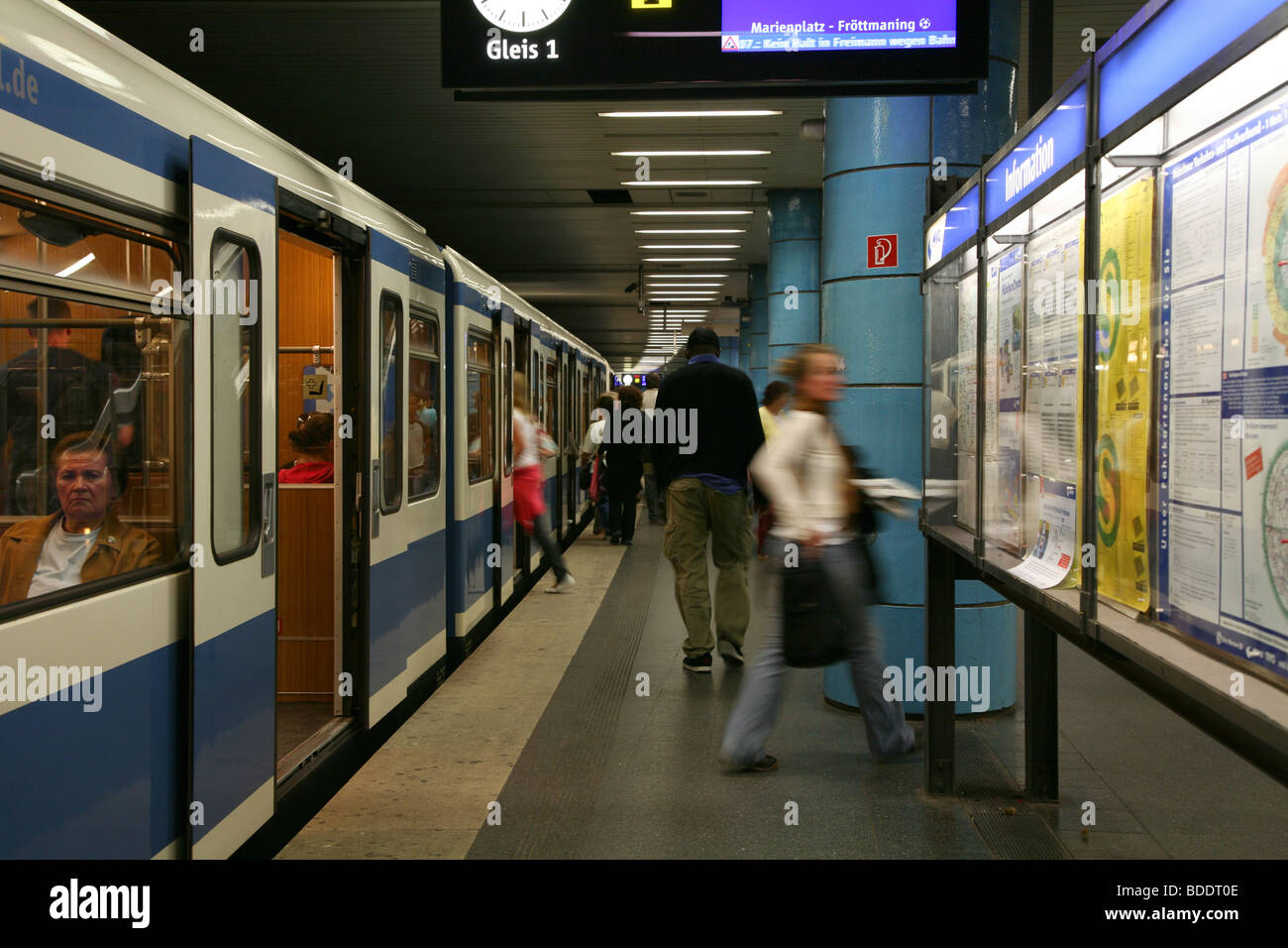 Platform in a station of the Munich underground as a train arrives ...