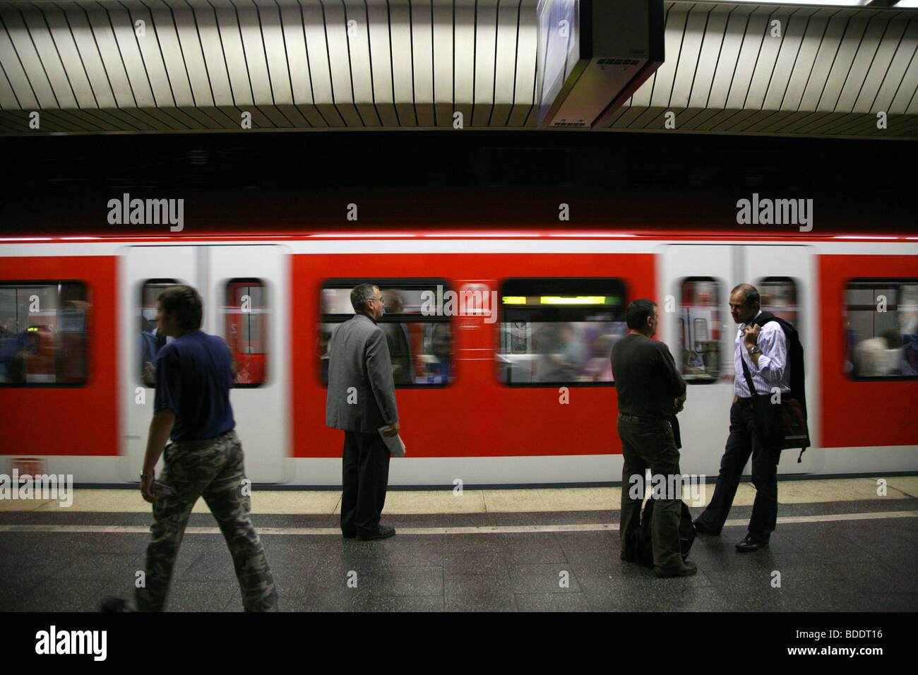 Platform in a station of the Munich underground as a train arrives ...