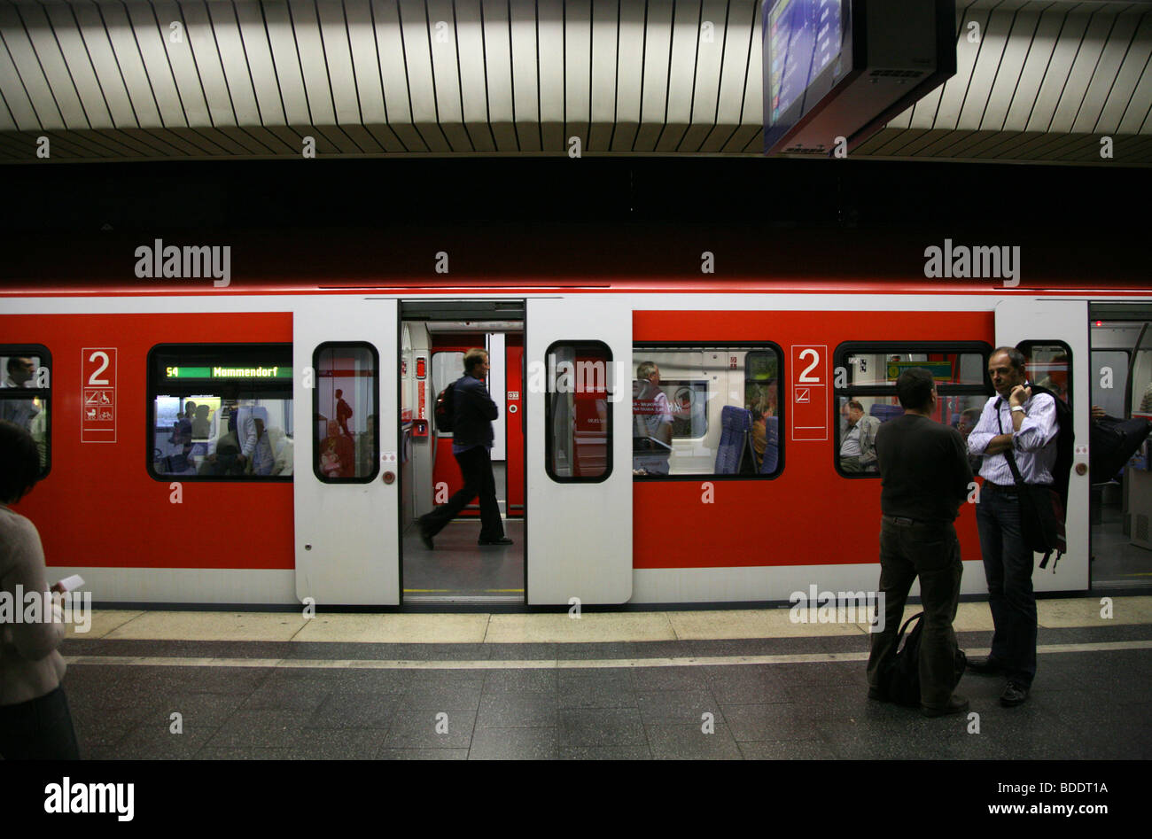 Platform in a station of the Munich underground as a train arrives ...