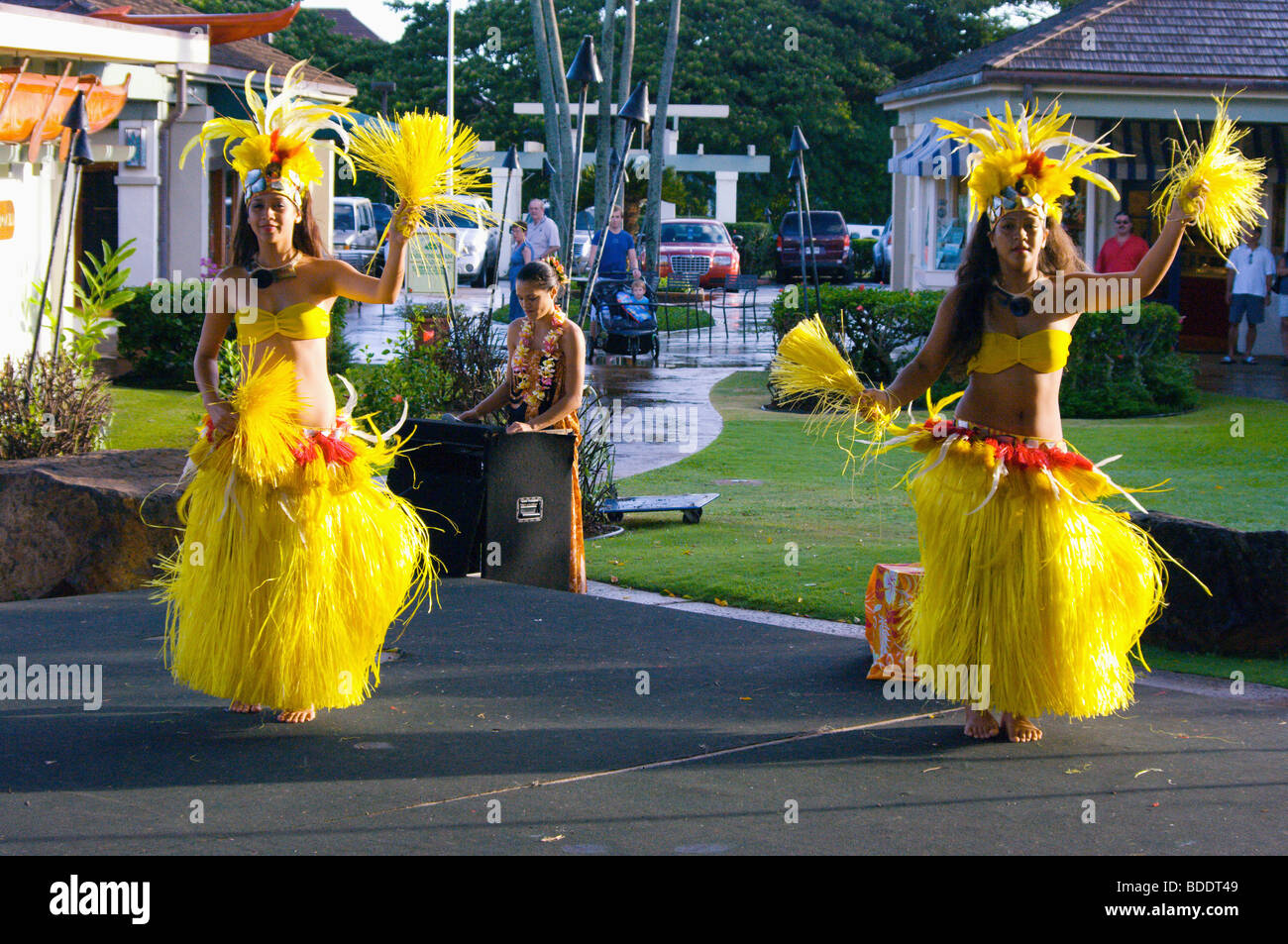 Two young Hawaiian women dancing the Tahitian otea at Poipu Shopping ...