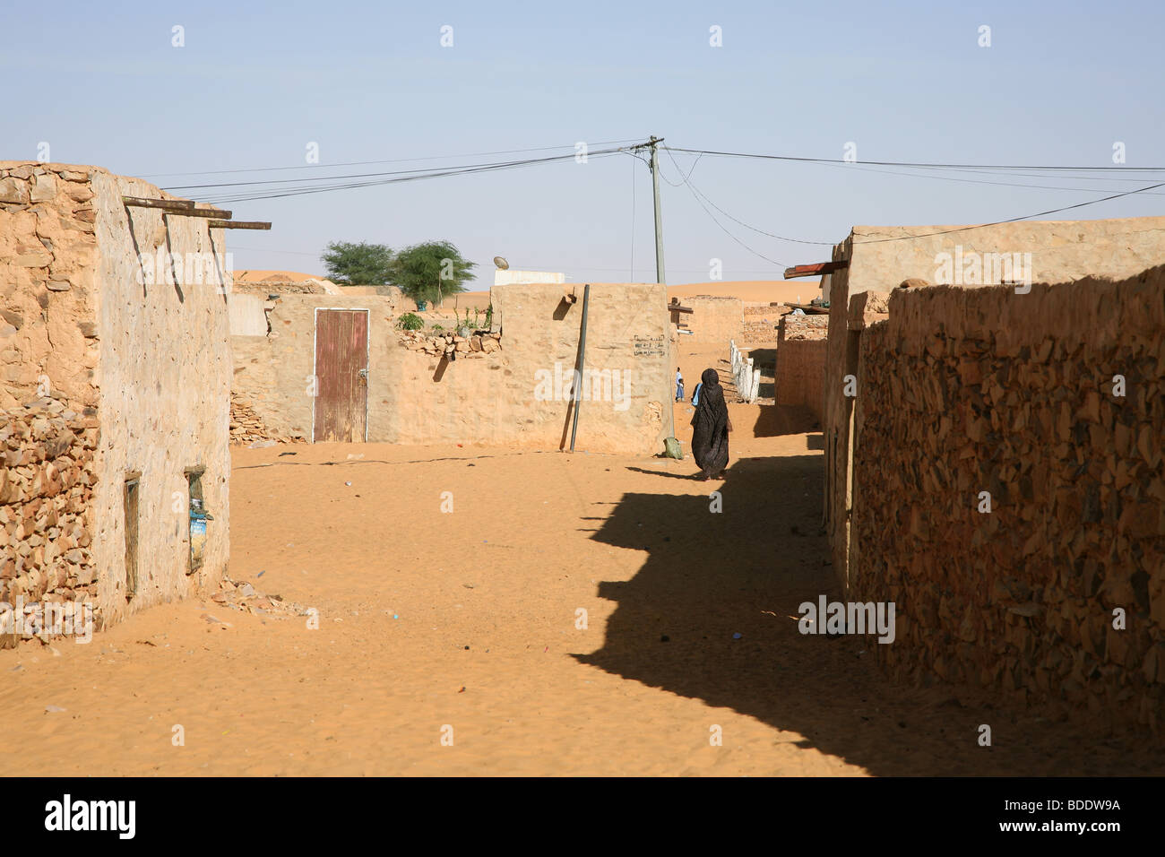 The ancient and half swallowed by sand town of Chinguetti, on the edge ...