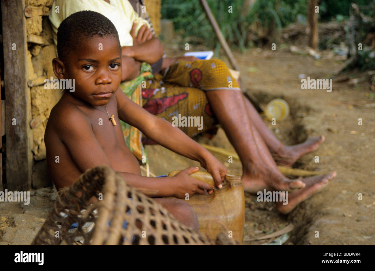 A young Baka Pygmy boy in a remote village in the rainforest bordering ...