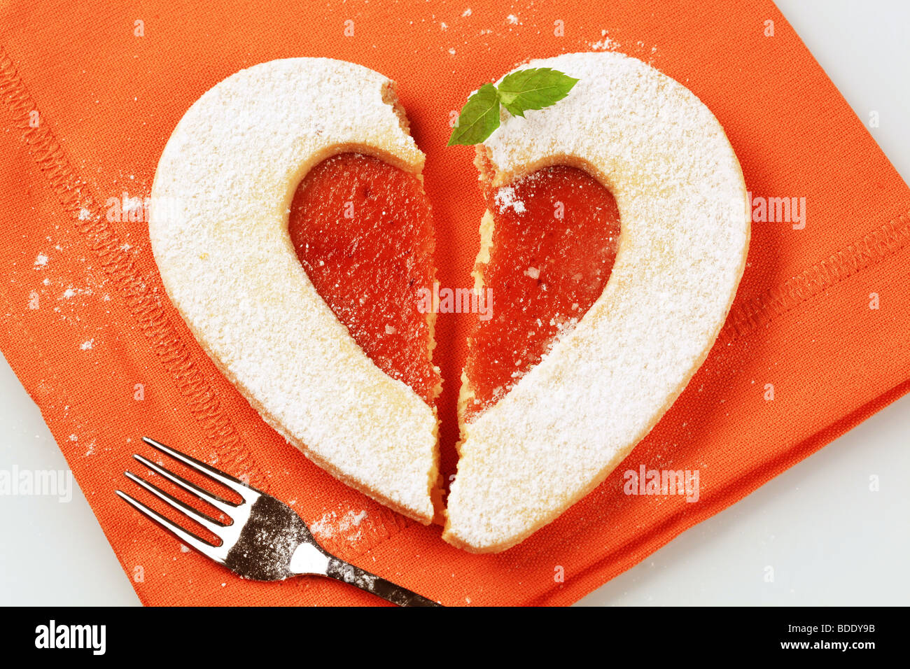 Heart shaped Linzer cookie split into two halves Stock Photo - Alamy