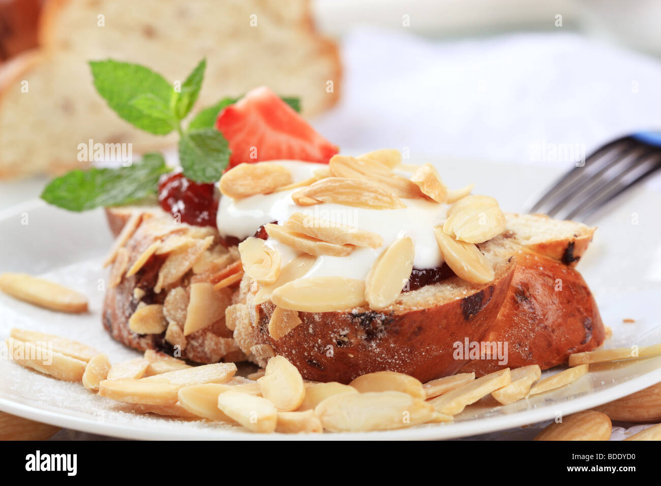 Sweet braided bread with jam and yogurt Stock Photo - Alamy