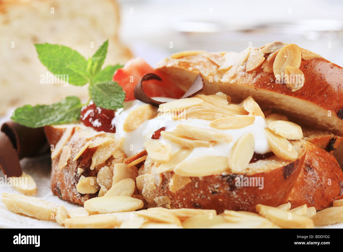 Sweet braided bread with jam and yogurt Stock Photo - Alamy