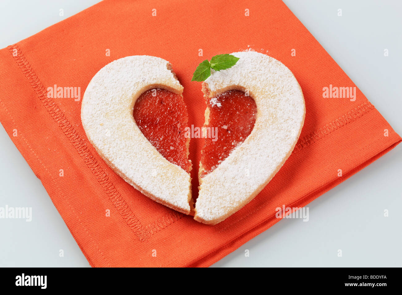 Heart shaped Linzer cookie split into two halves Stock Photo - Alamy