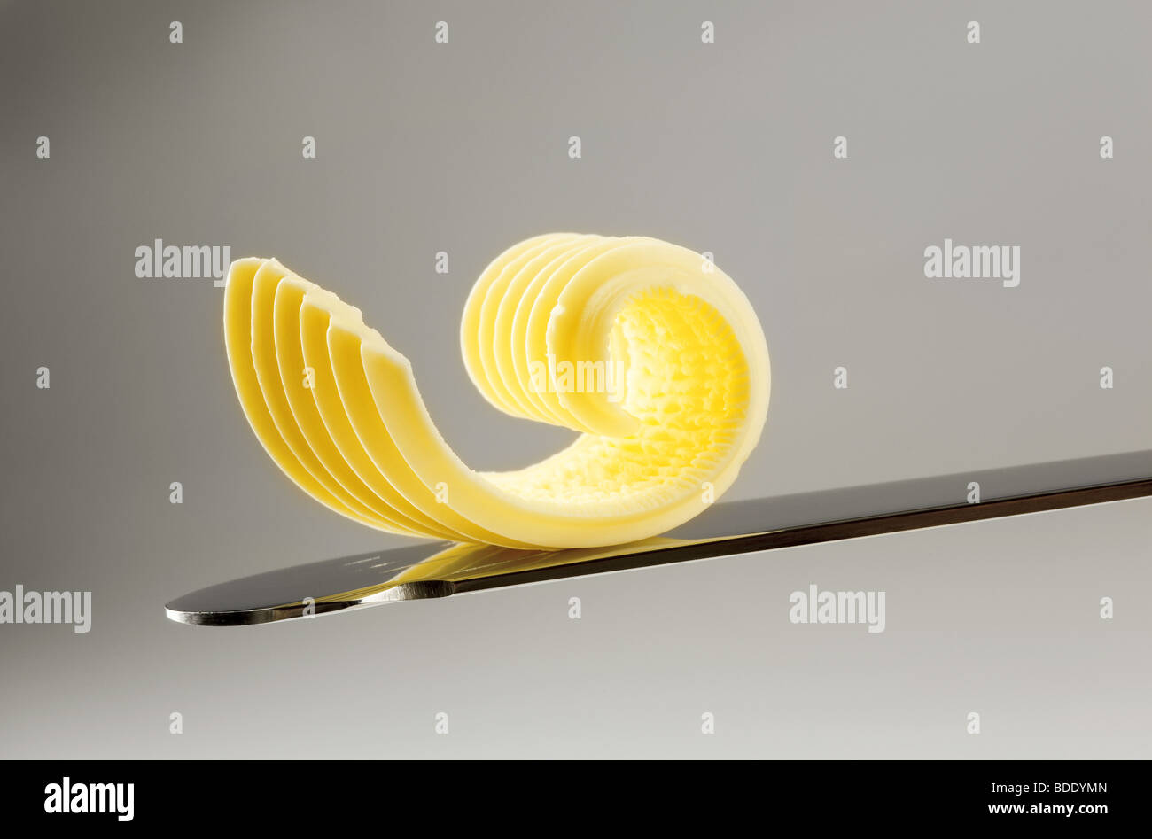 Butter curl on a knife Stock Photo - Alamy