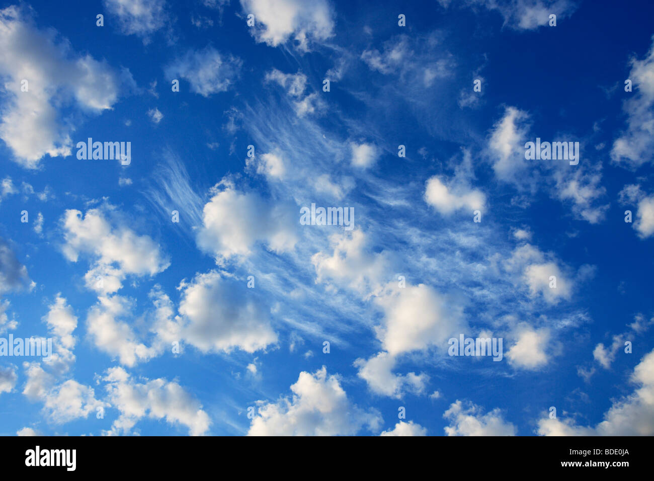Some dissipating cumulus clouds at dawn Stock Photo - Alamy