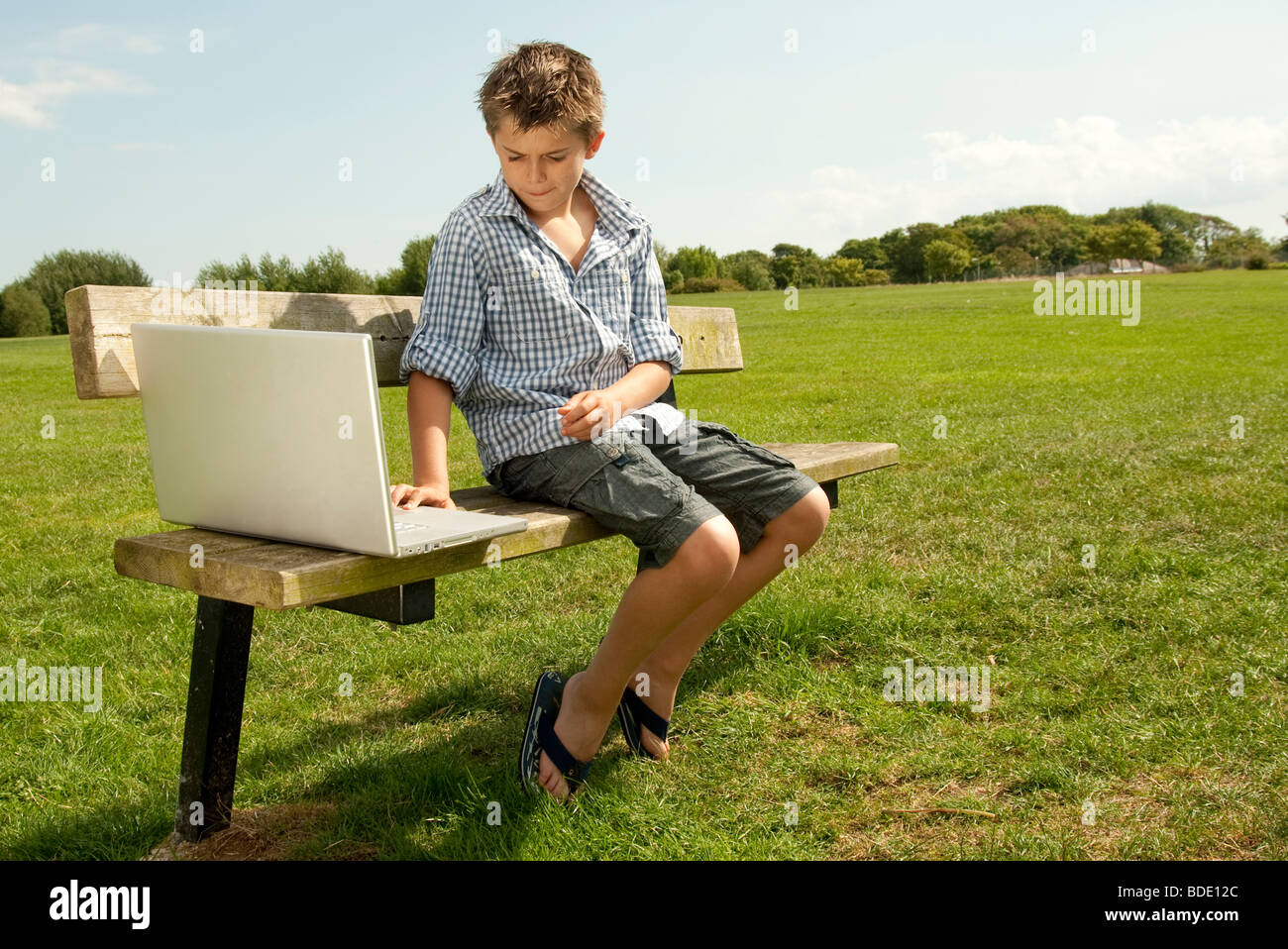 boy using laptop Stock Photo - Alamy