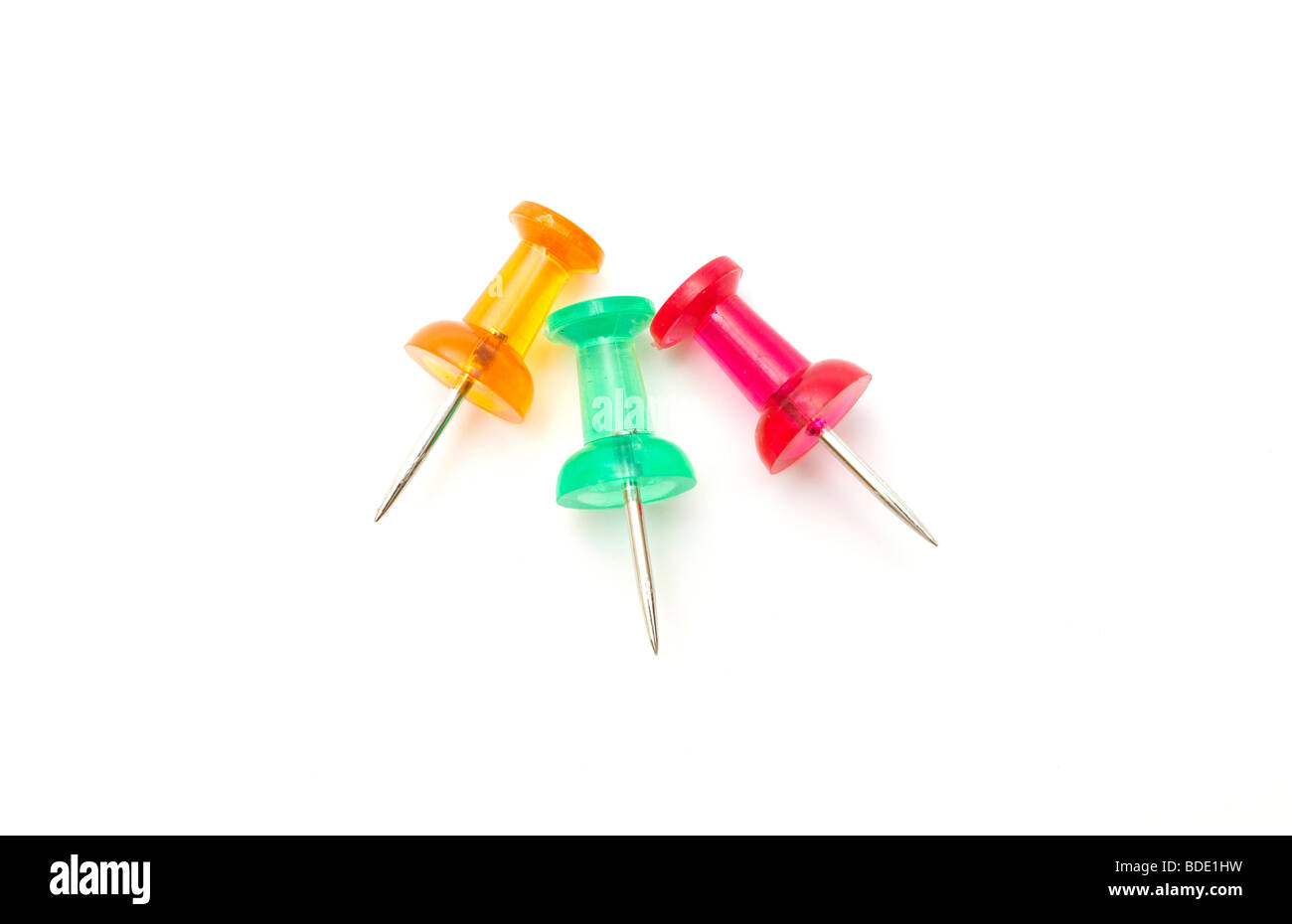 Different color drawing-pins on white background Stock Photo - Alamy
