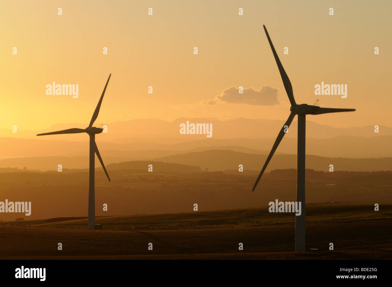 Windturbines on Caton Moor, with lakeland hills in the distance at ...