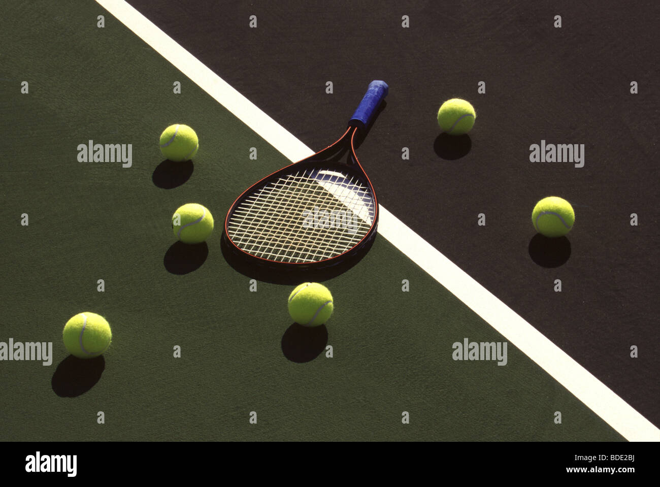 Tennis racquet and balls Stock Photo - Alamy
