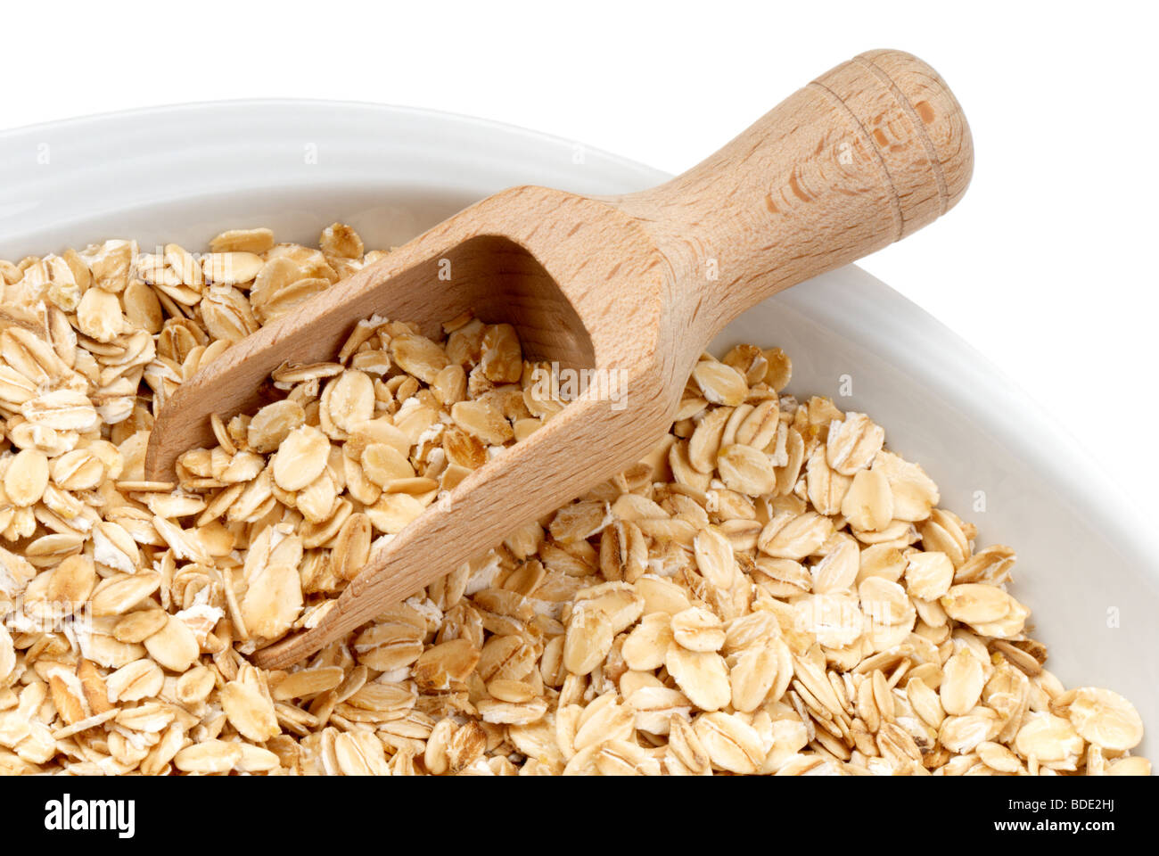 Seeds of oats with wooden spatula. Macro Stock Photo - Alamy
