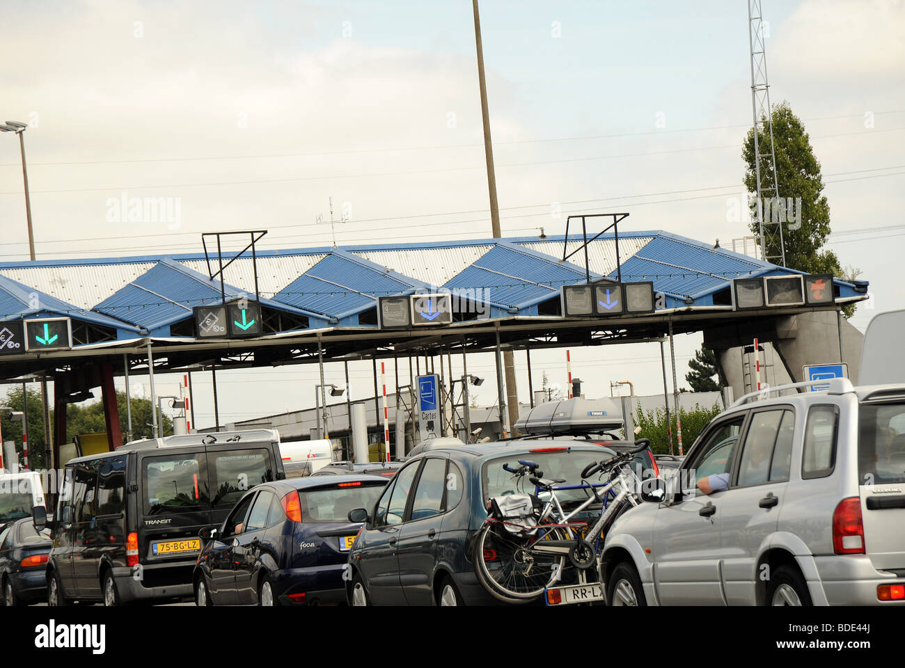 cars approaching tollbooths Stock Photo - Alamy