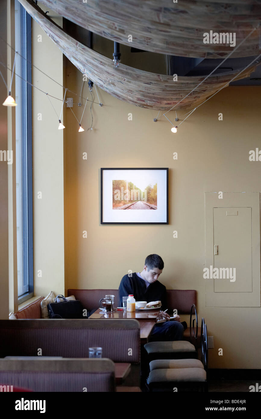 Patron customer eating alone at restaurant Stock Photo - Alamy