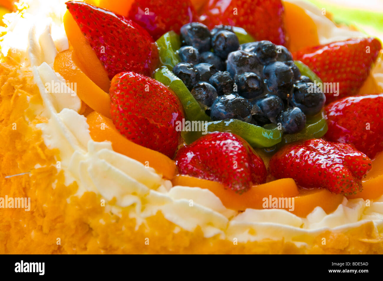 Cake with fresh fruit toppings Stock Photo - Alamy
