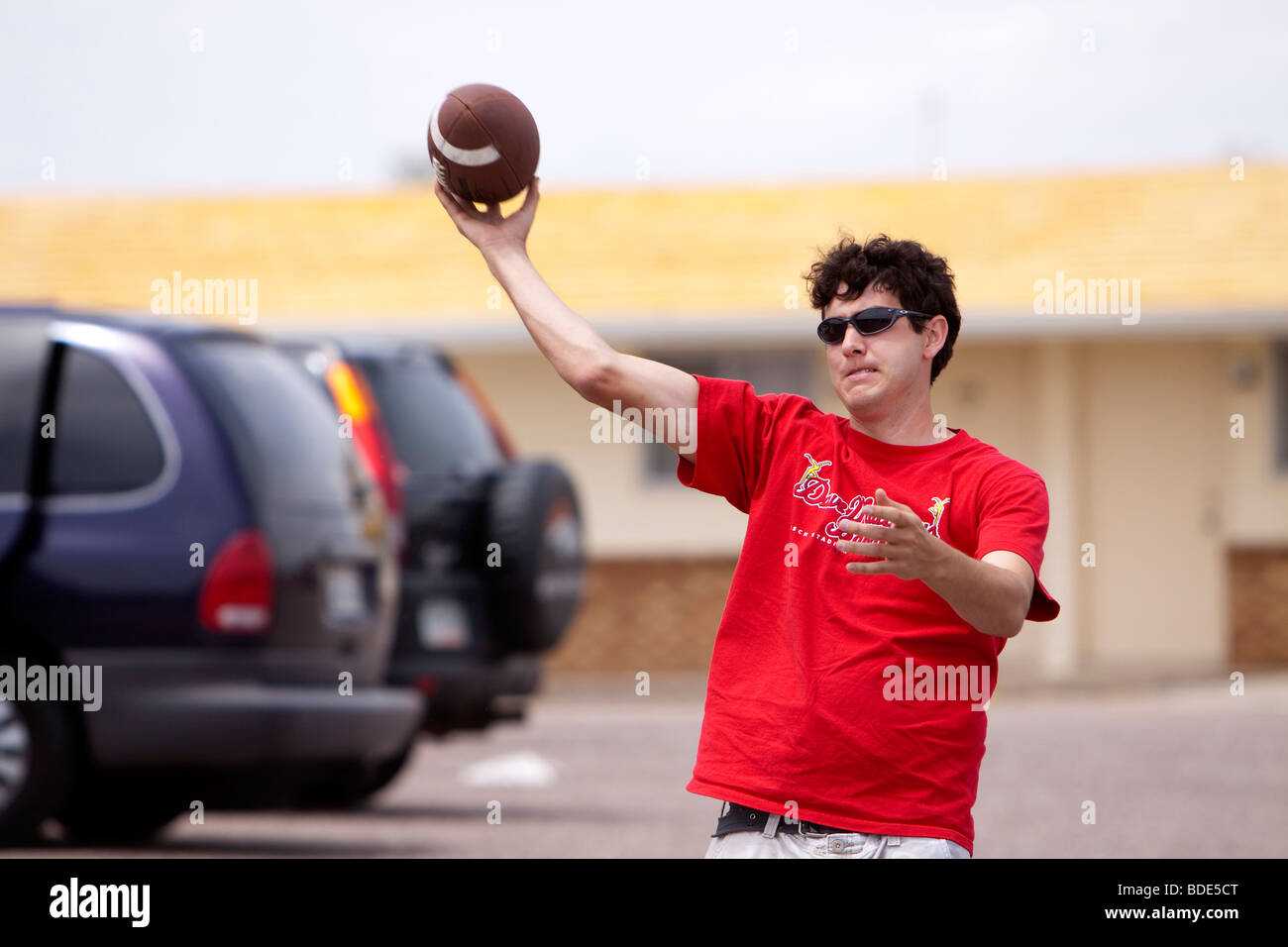 Storm chaser Andrew Arnold tosses a football to relax during Project ...
