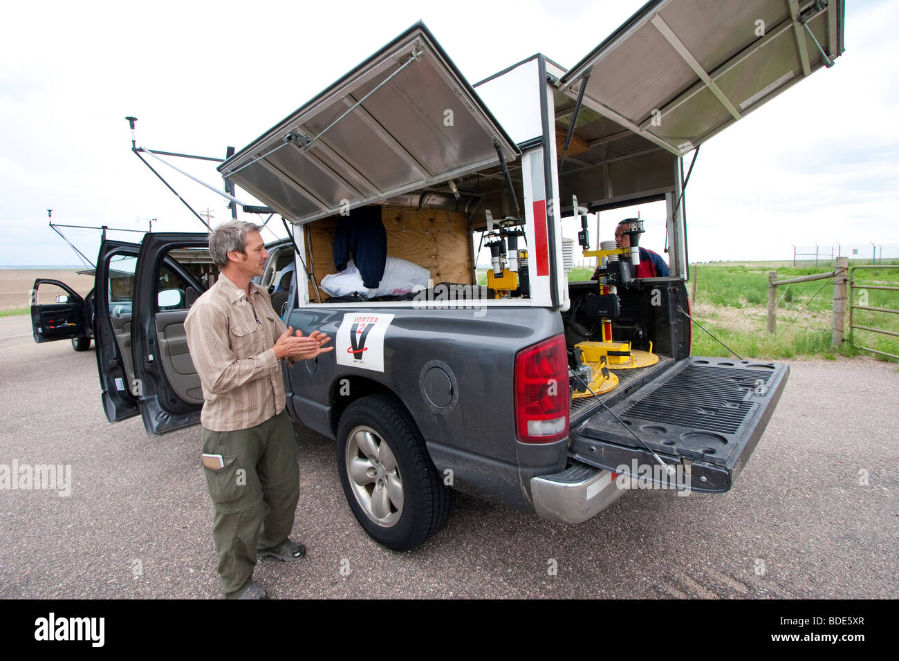 A Vortex 2 storm chaser checks the tornado pods in the back of his ...
