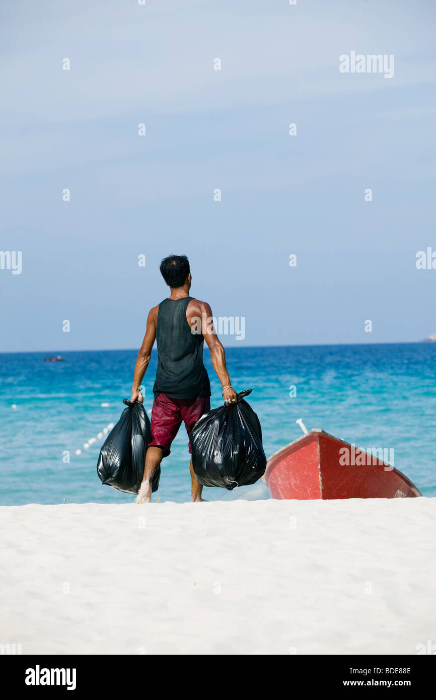 Man carrying trash bag hi-res stock photography and images - Alamy