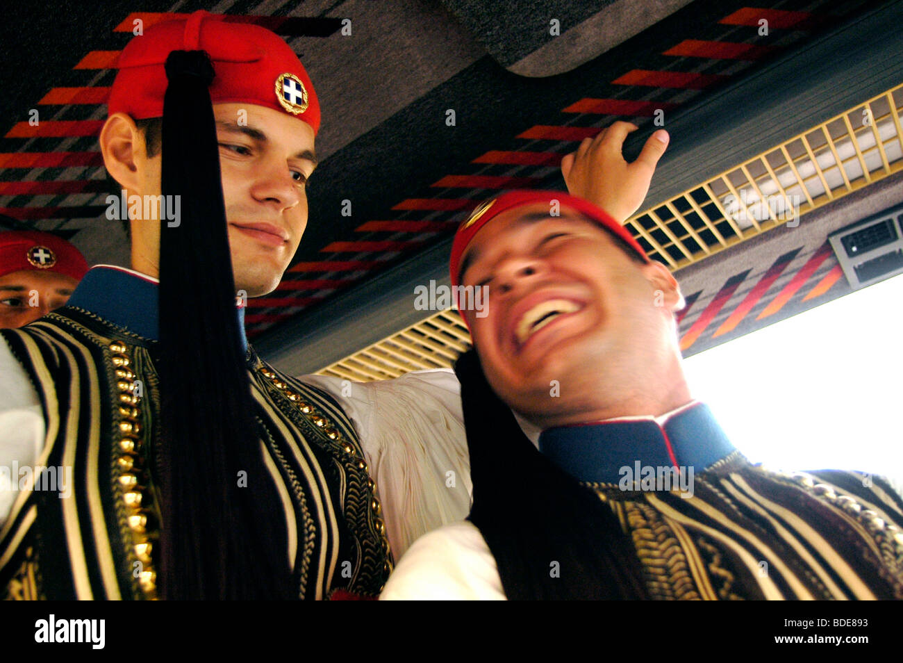 Evzonoi on the bus going to Acropolis Stock Photo - Alamy