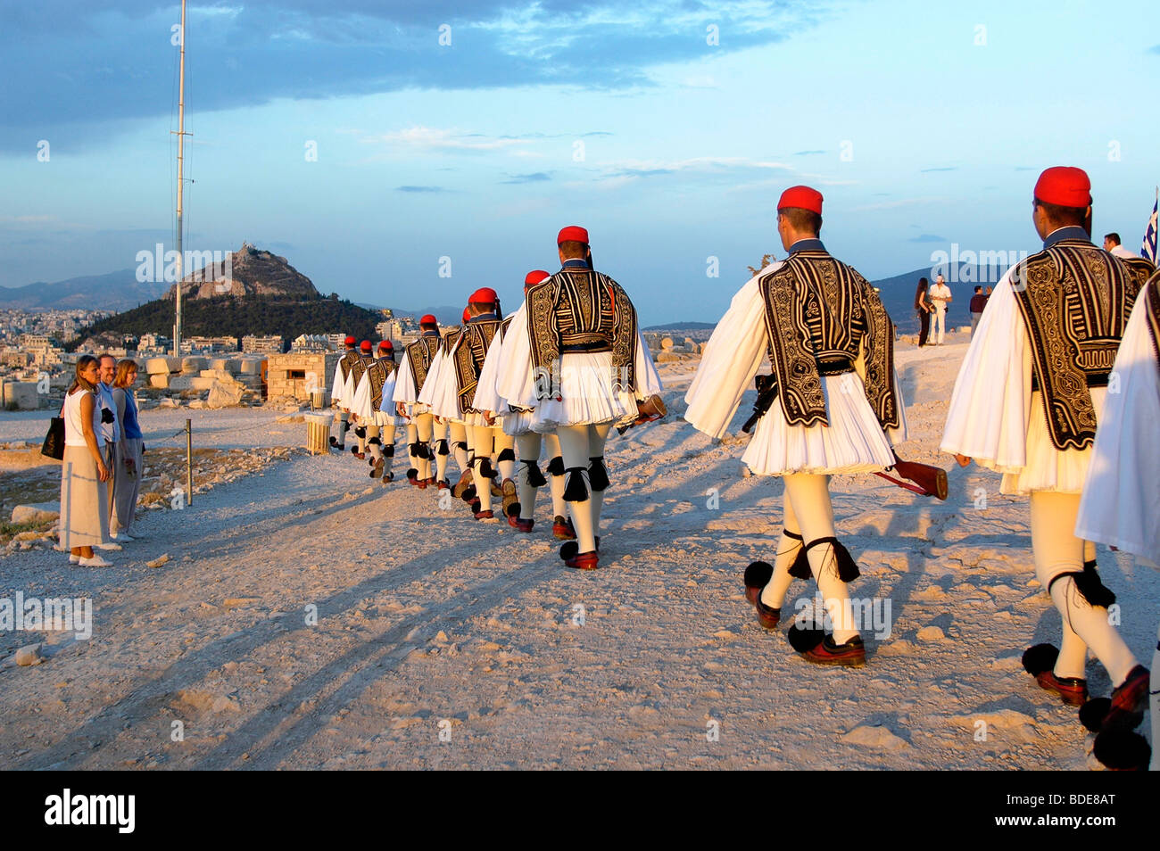 Evzonoi, Greek presidential guards, marching to the flag post. Every ...