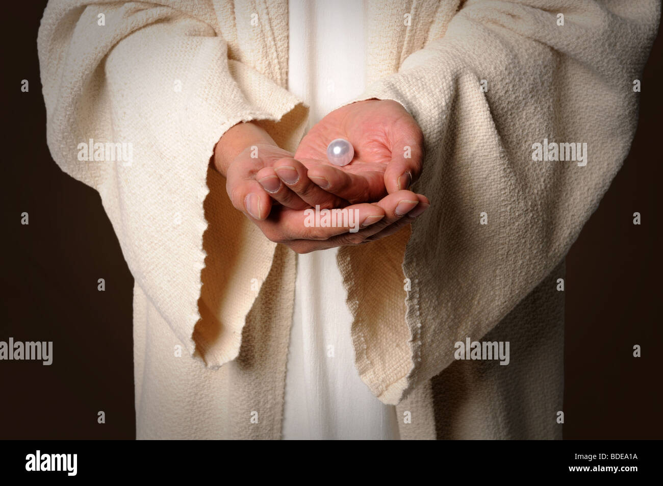 Hands of Jesus holding pearl - The parable of the pearl of great price ...