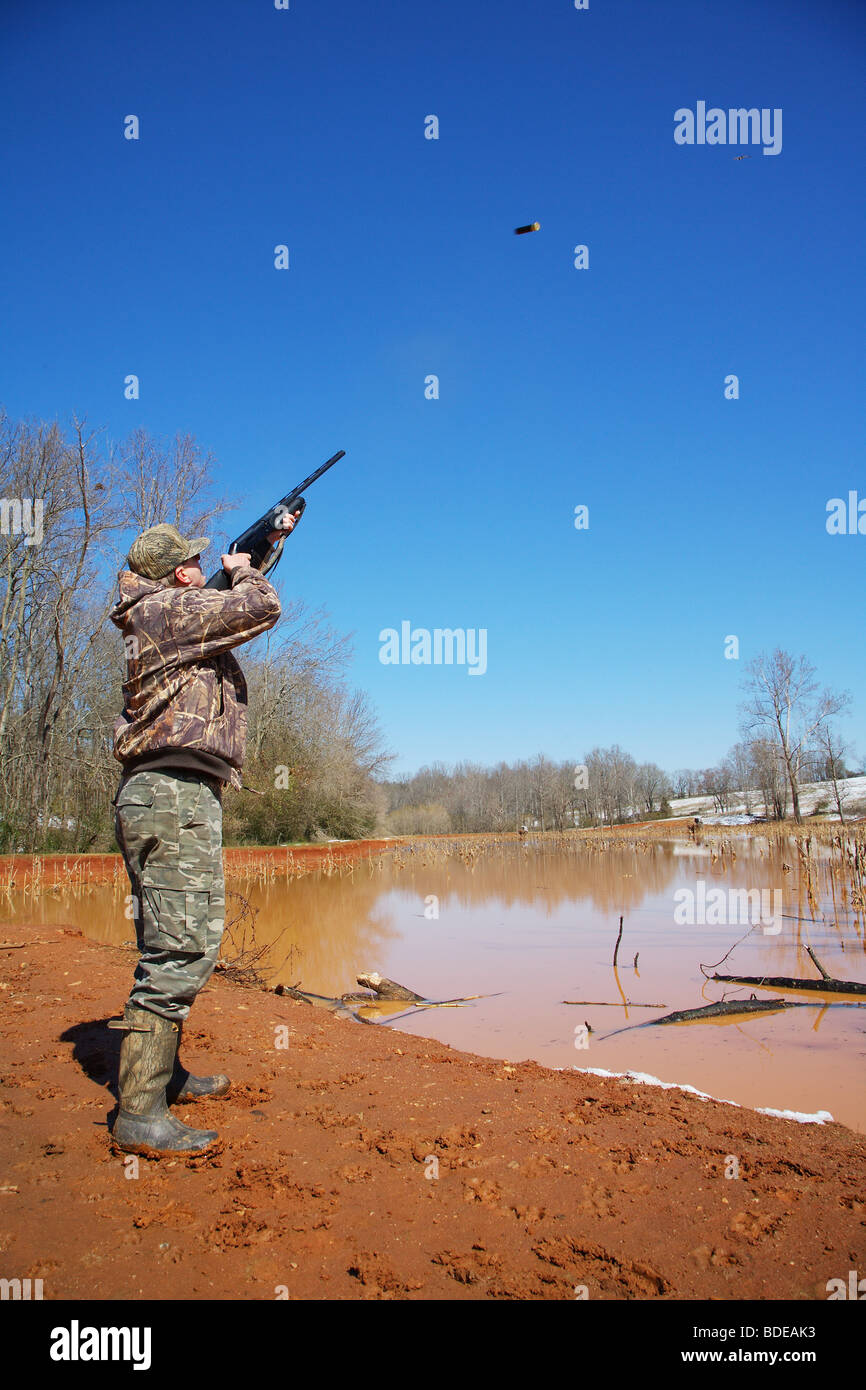 DUCK HUNTER SHOOTING AT MALLARD SHELL EJECTING BIRD IN VIEW GEORGIA ...