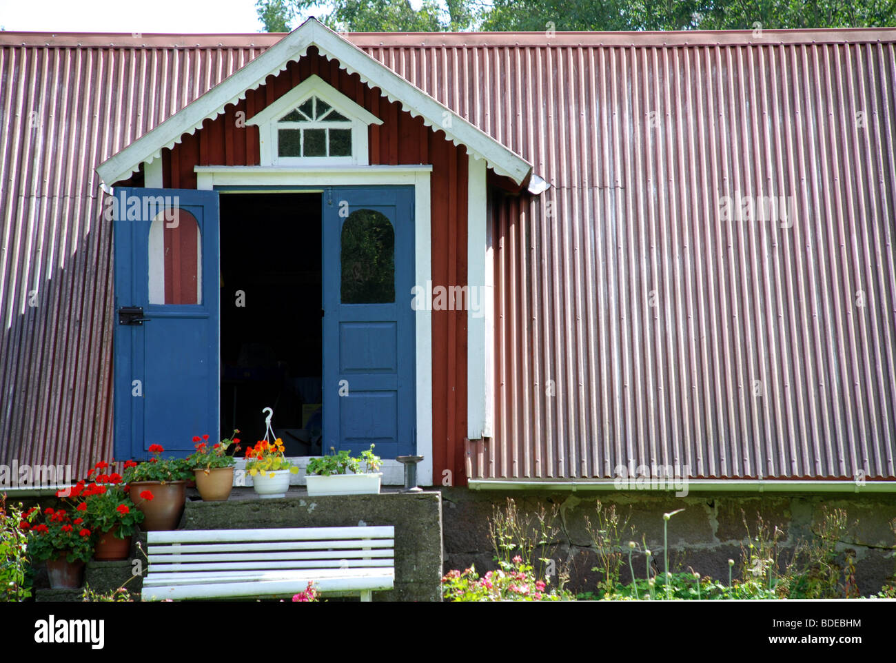 Barn in a garden Stock Photo - Alamy