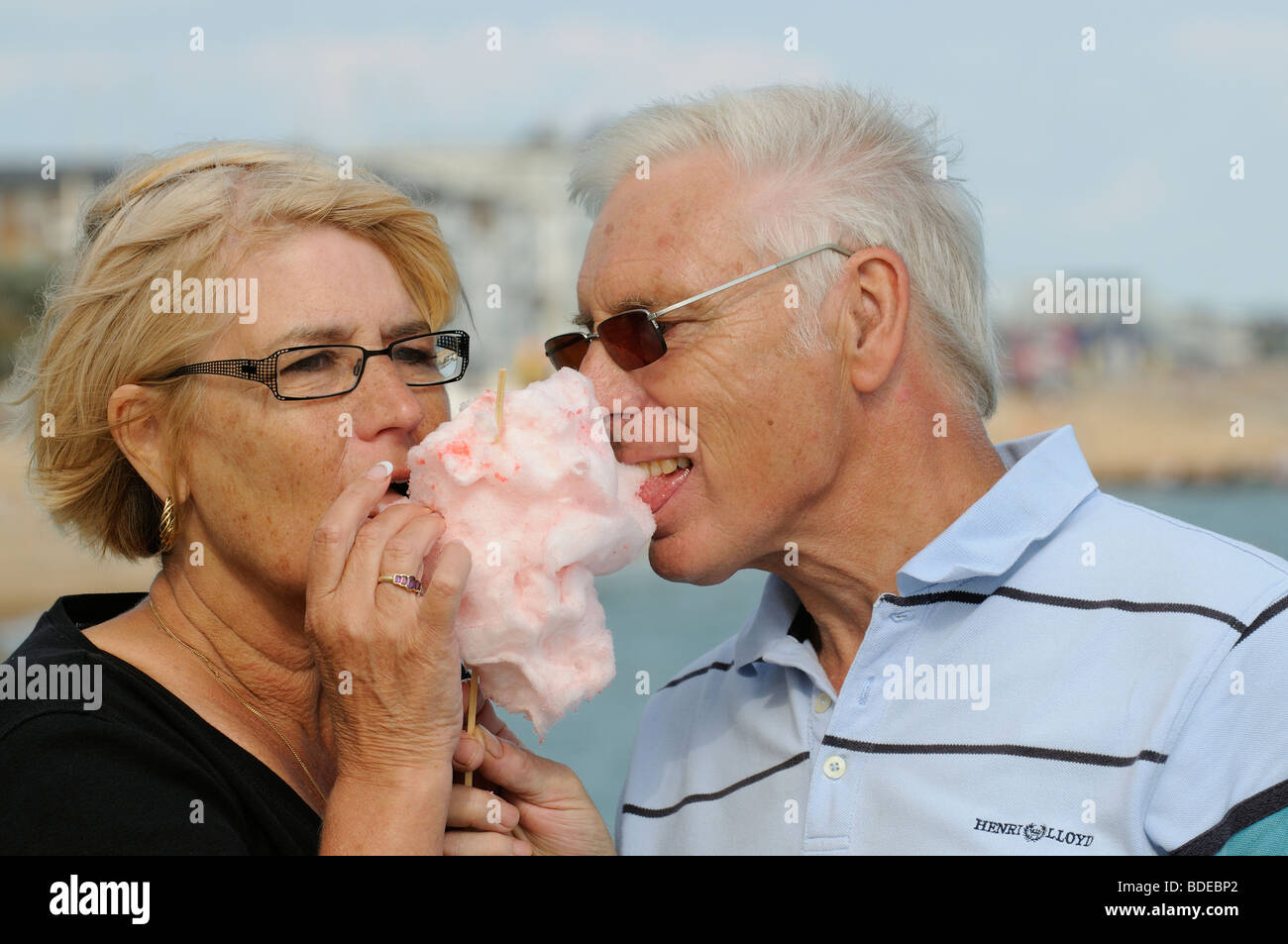 Couple eating candy floss hi-res stock photography and images - Alamy