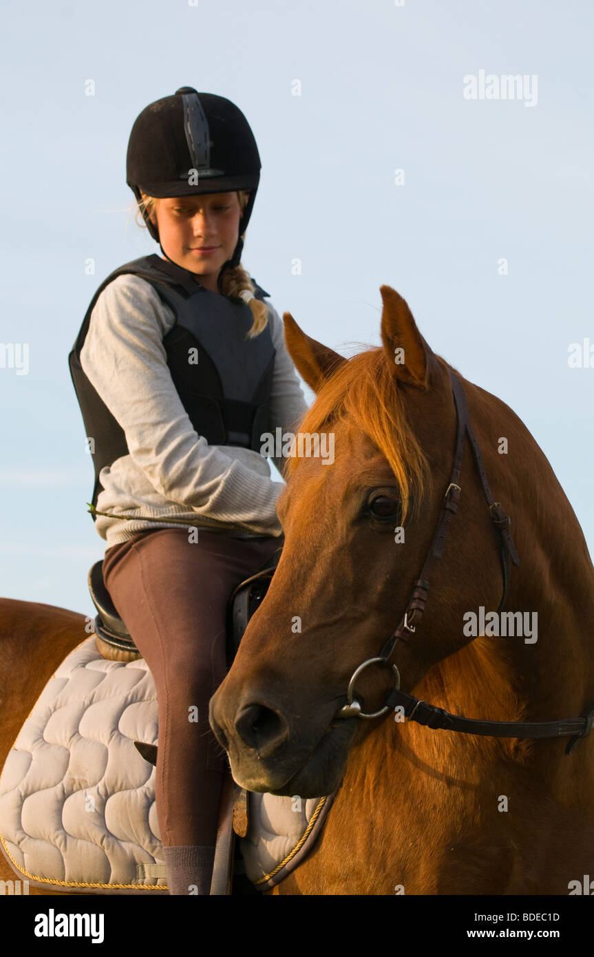Young girl riding a pony Stock Photo - Alamy