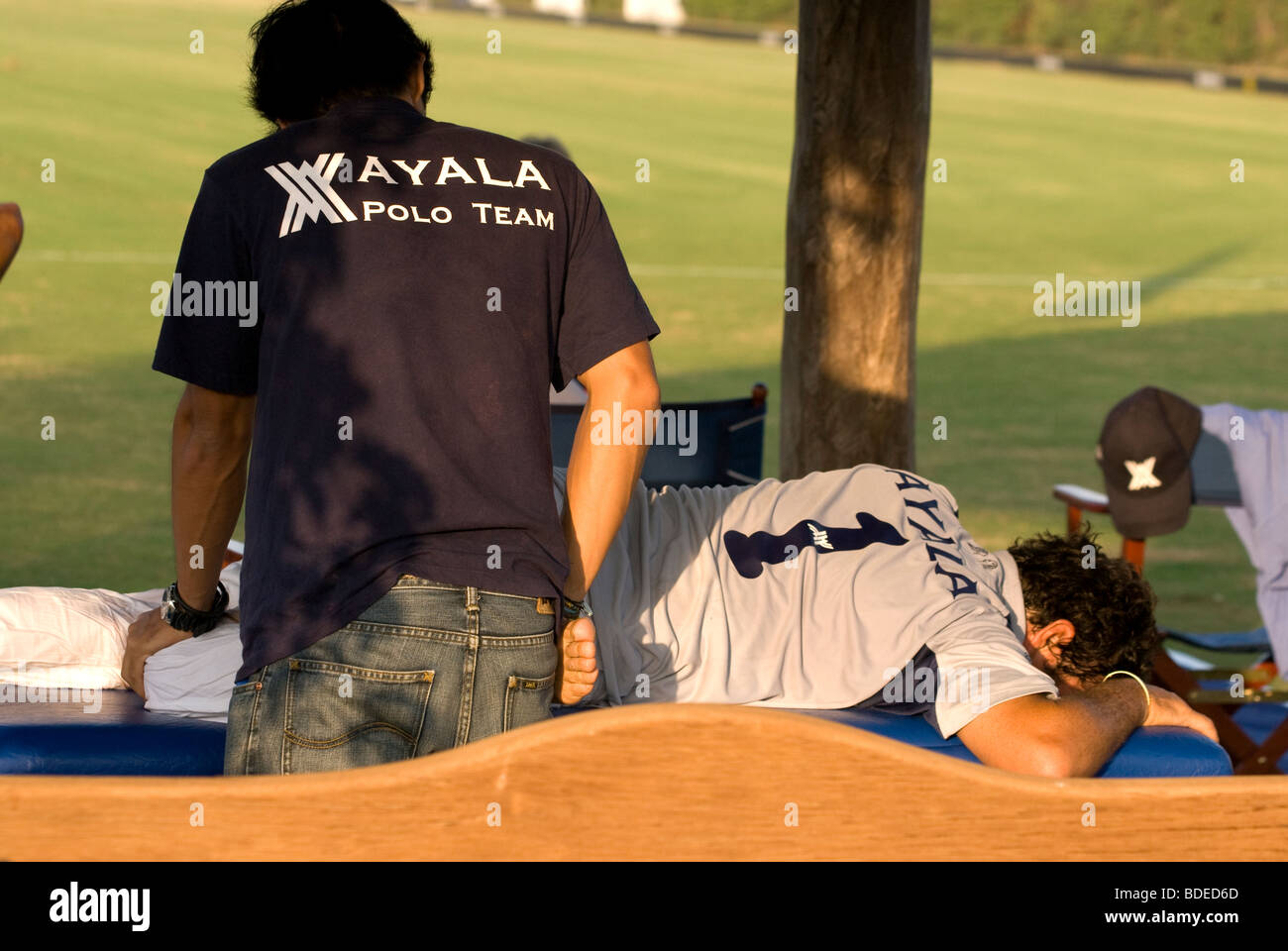 Polo player receiving treatment to leg after game Stock Photo - Alamy