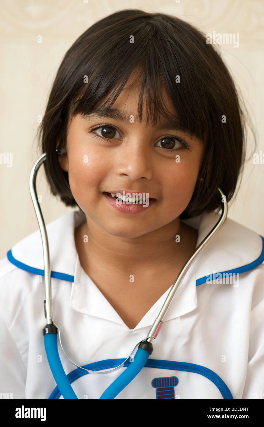 Child in a nurse uniform playing with a stethoscope Stock Photo - Alamy