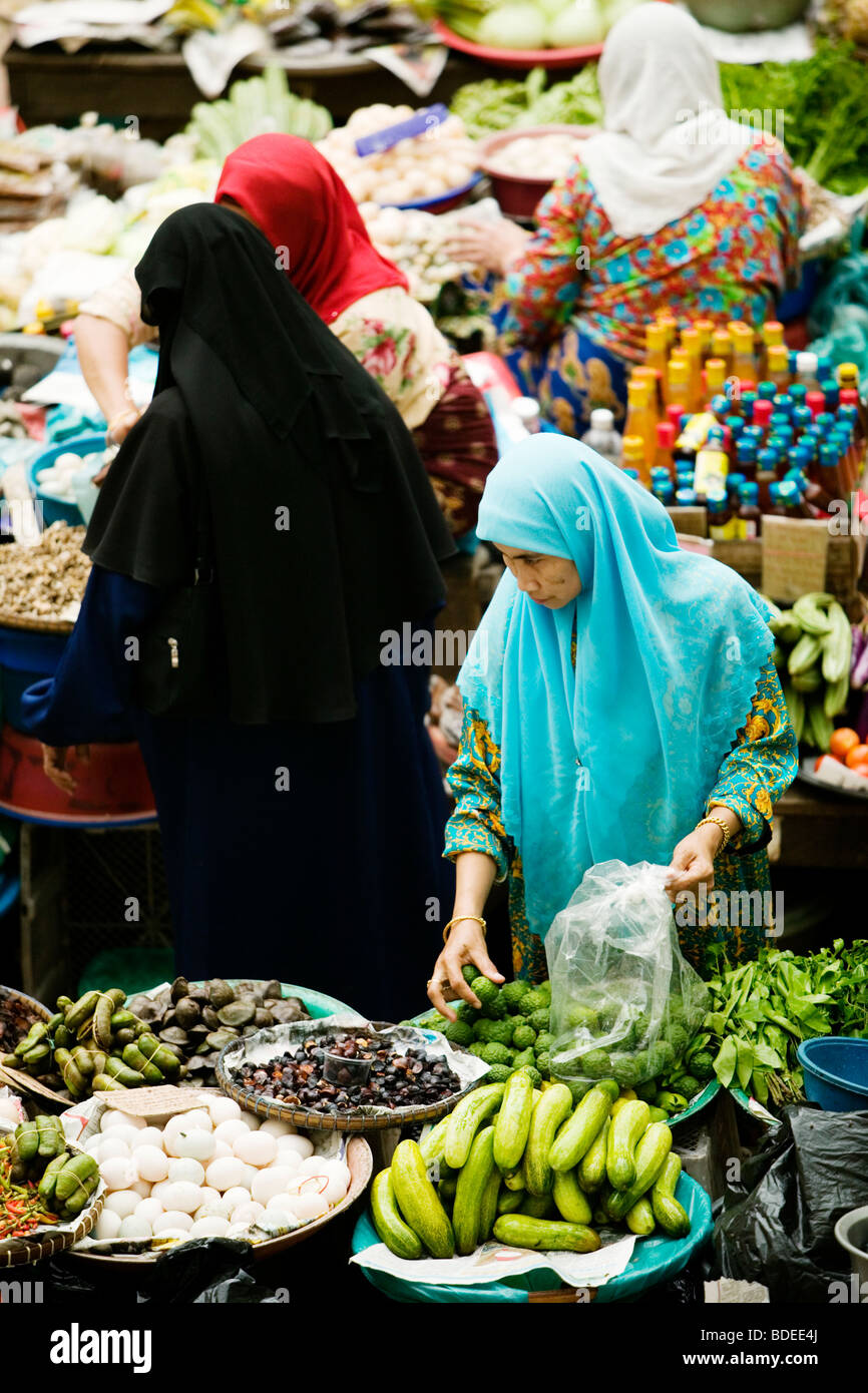 Muslim women shopping vegetables at Kota Bharu market, Malaysia Stock ...