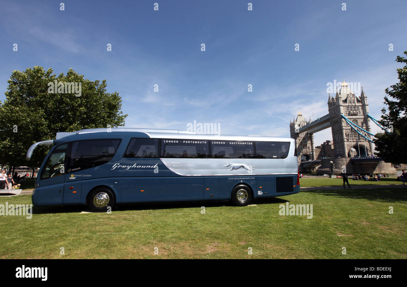 Greyhound coach operated by First Group in front of Tower bridge in ...