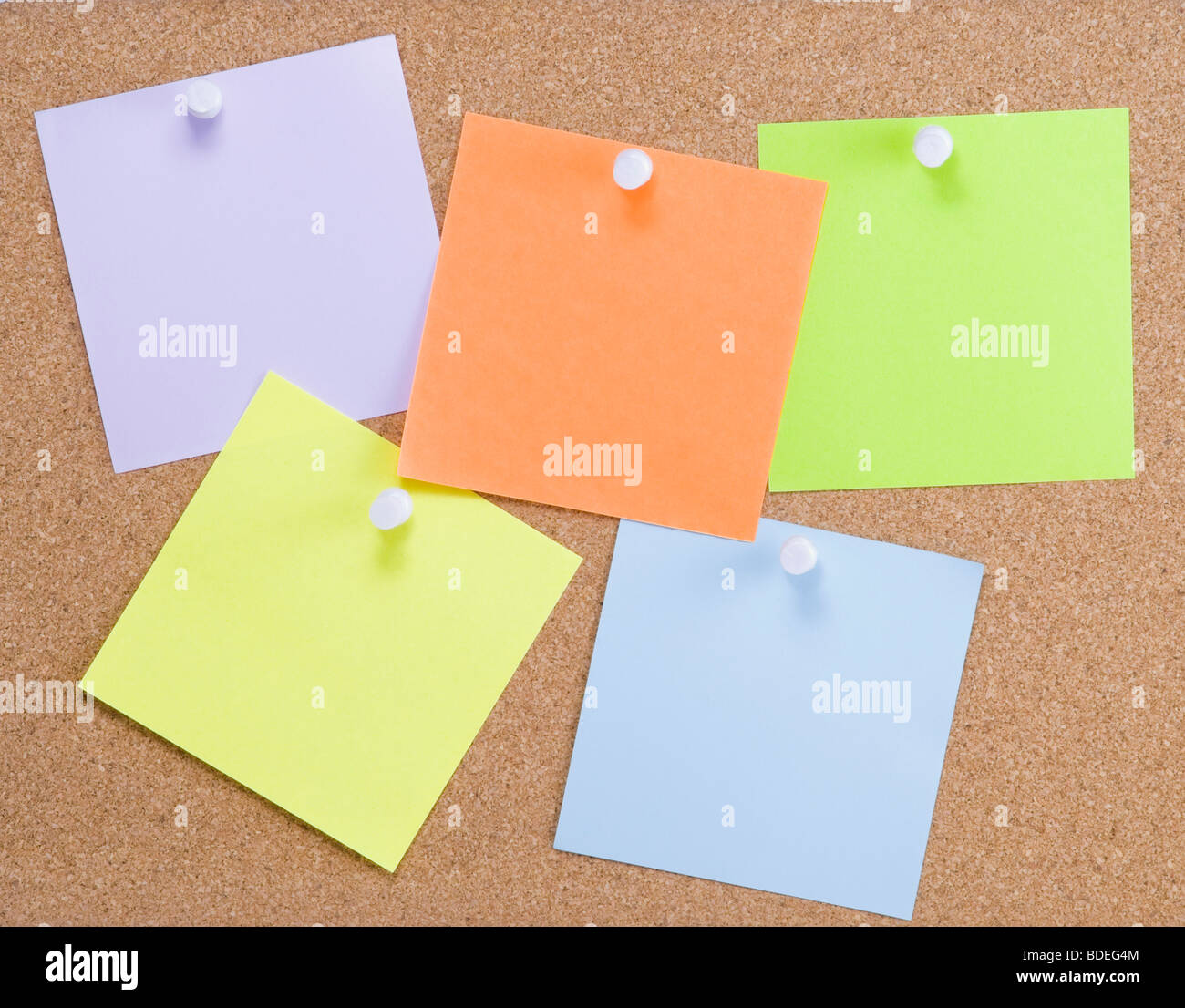 Colorful sticky notes attached to a corkboard Stock Photo - Alamy