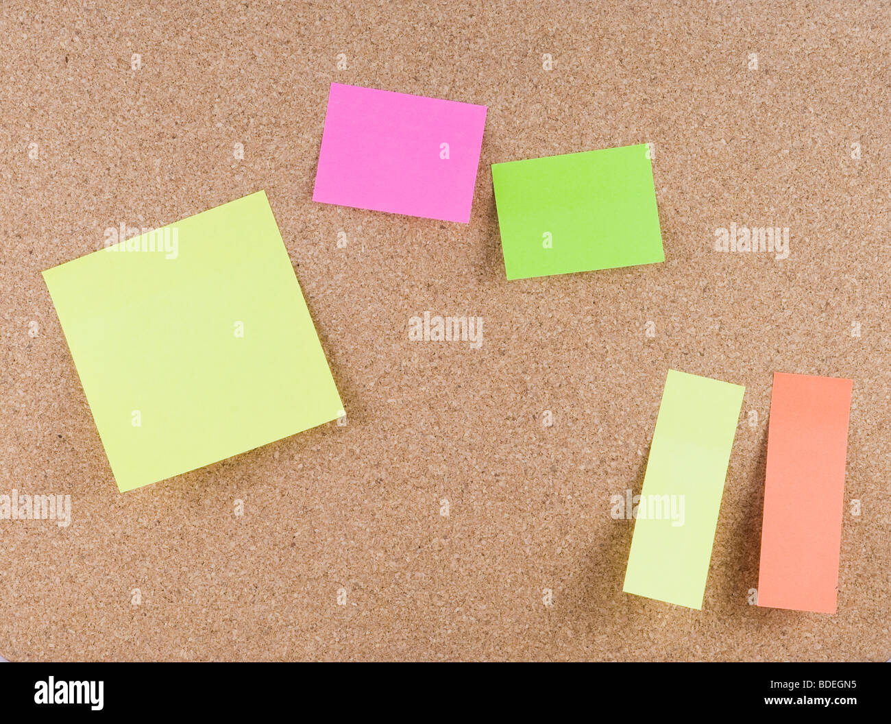Colorful sticky notes attached to a corkboard Stock Photo - Alamy