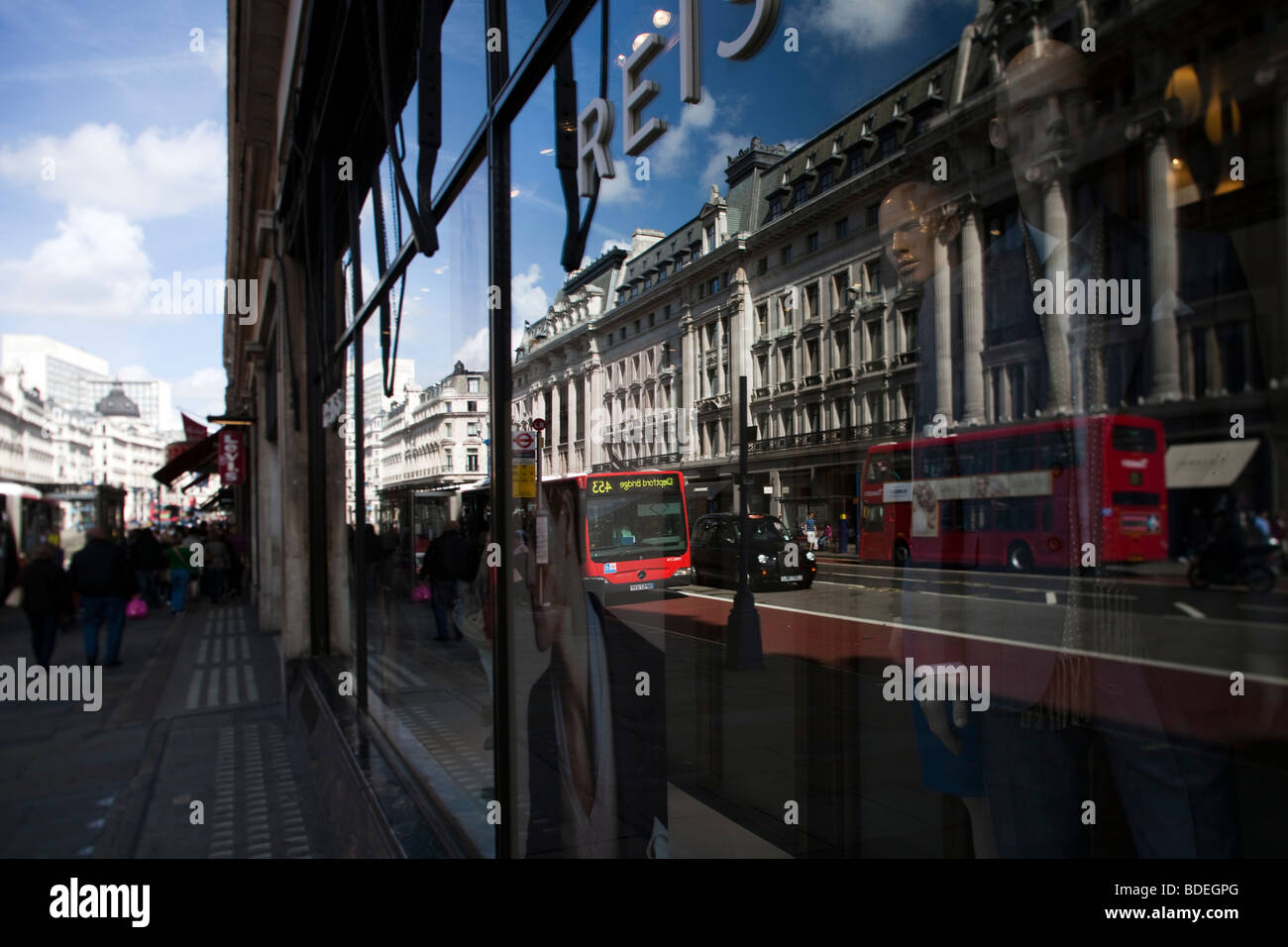 Reflections on a shop window, Regent Street, Westminster, London ...