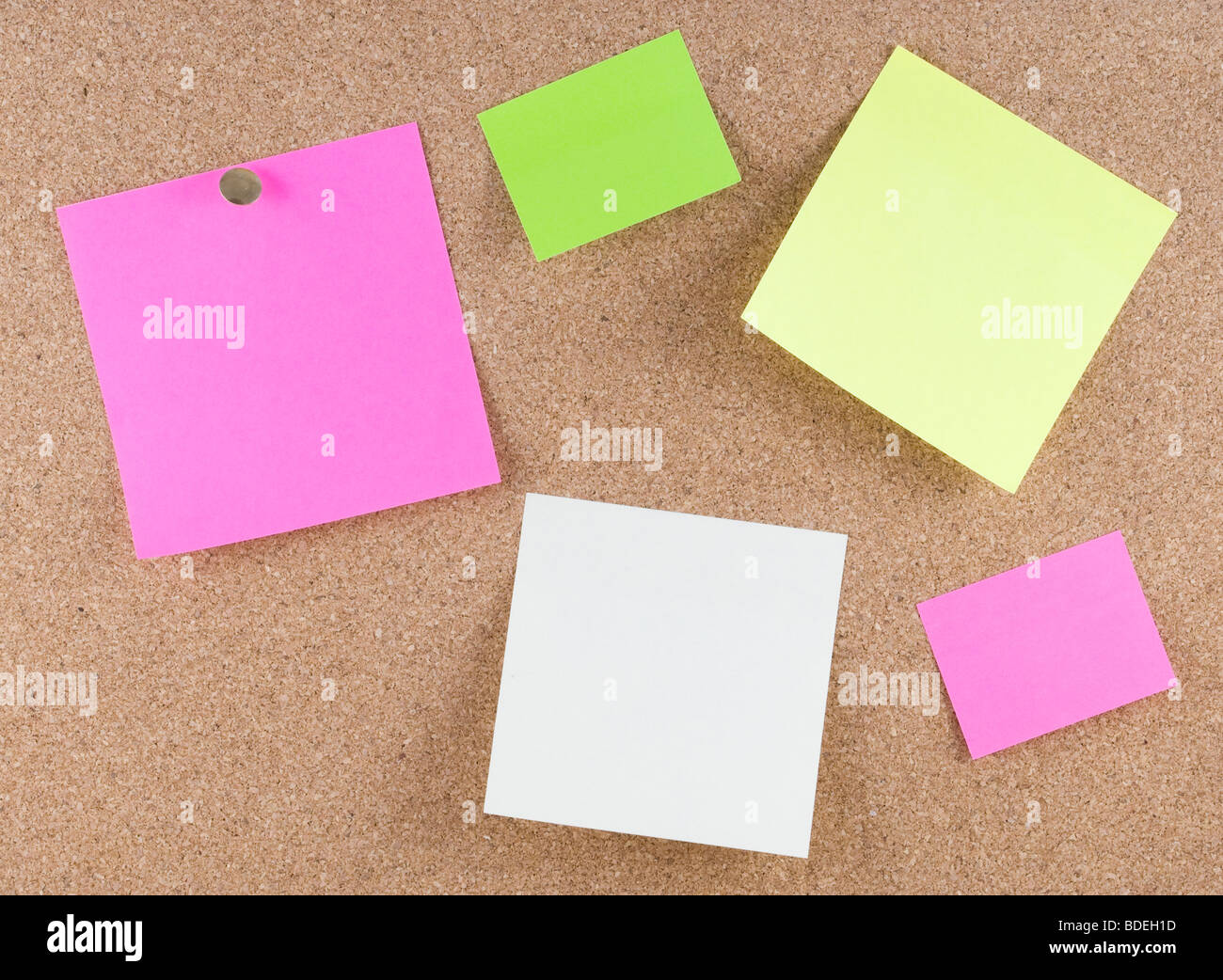 Colorful sticky notes attached to a corkboard Stock Photo - Alamy