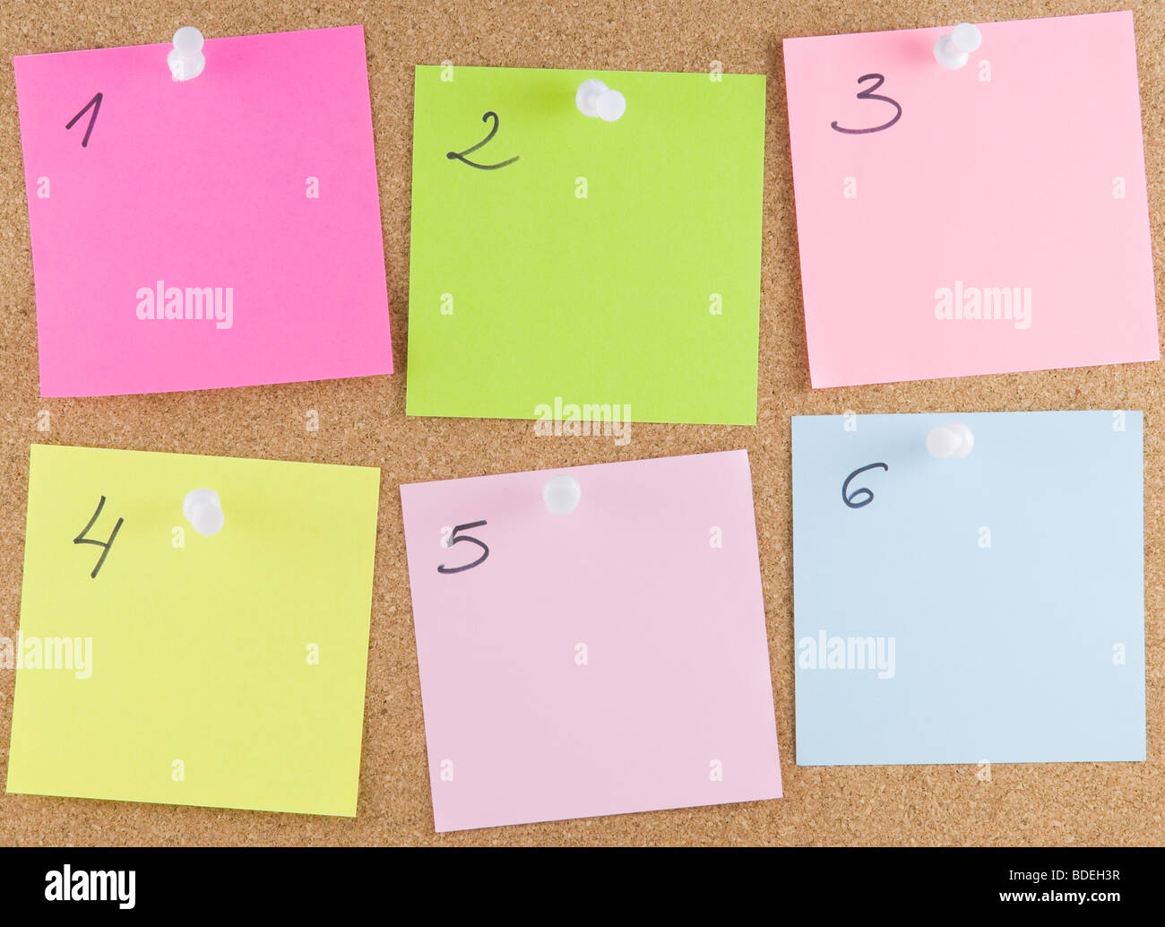 Colorful sticky notes attached to a corkboard Stock Photo - Alamy