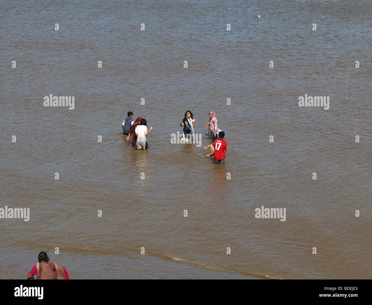 Indian group bathing in the North sea at Skegness,Lincolnshire Stock ...