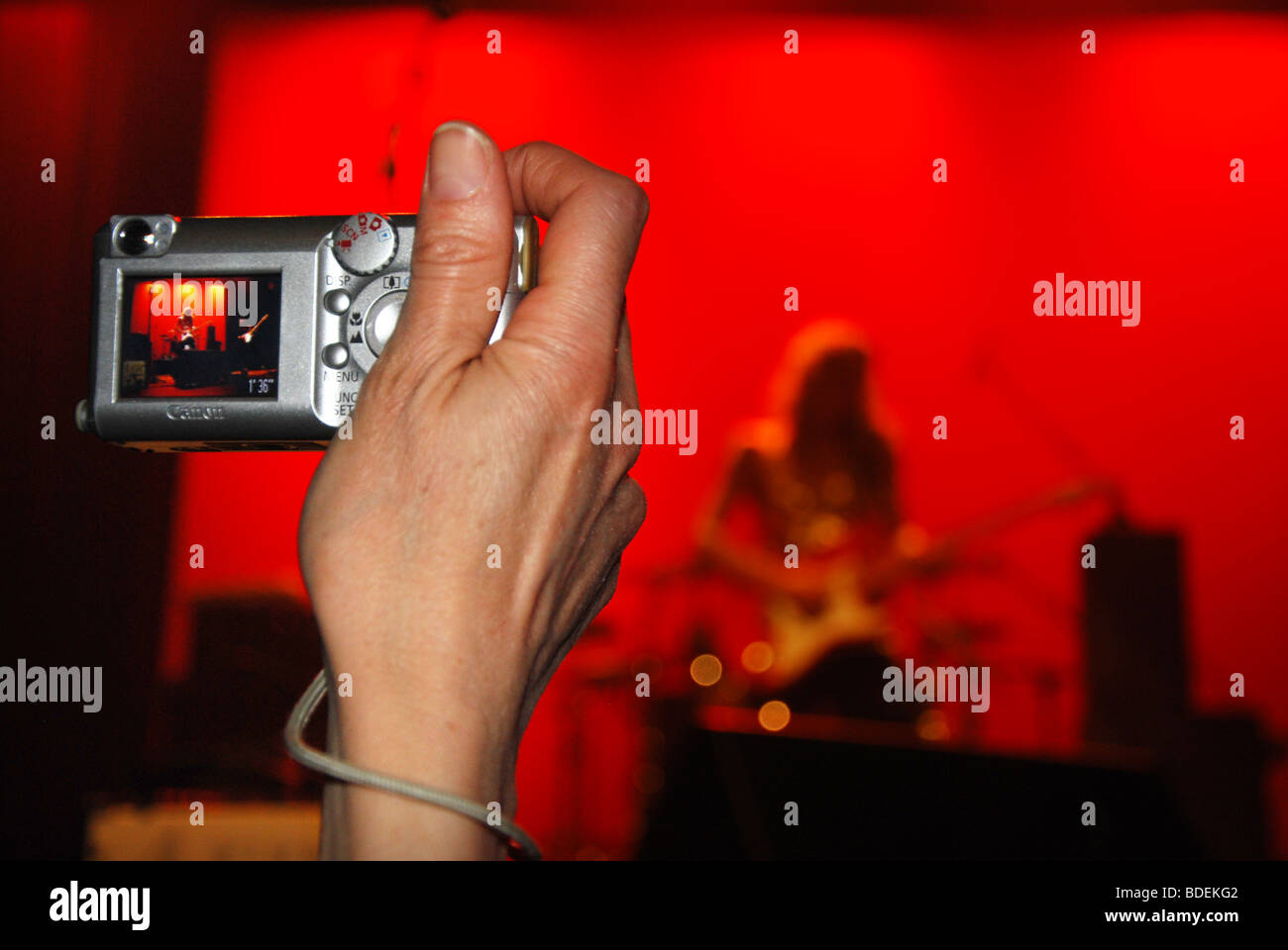 spectator taking snapshot at rock concert with digital camera Stock ...