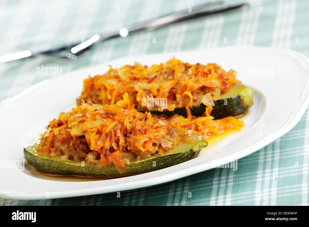 Stuffed zucchini in white plate Stock Photo - Alamy