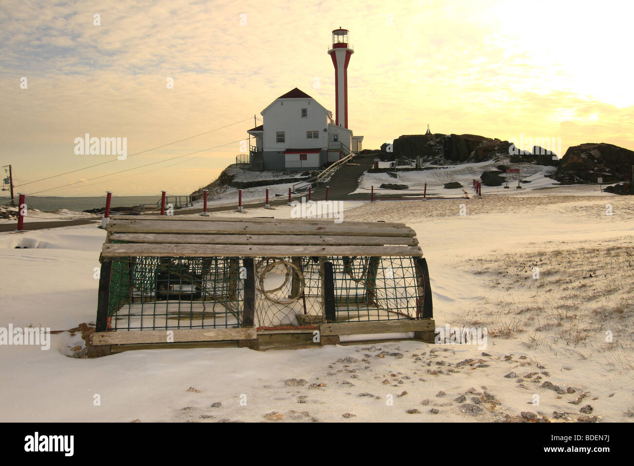 Cape Forchu Lighthouse in Nova Scotia Canada in winter with snow Stock ...