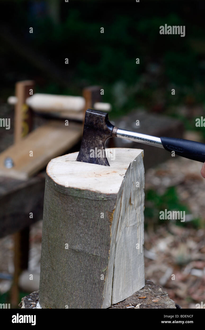 hand axe (hatchet) embeded in log Stock Photo - Alamy