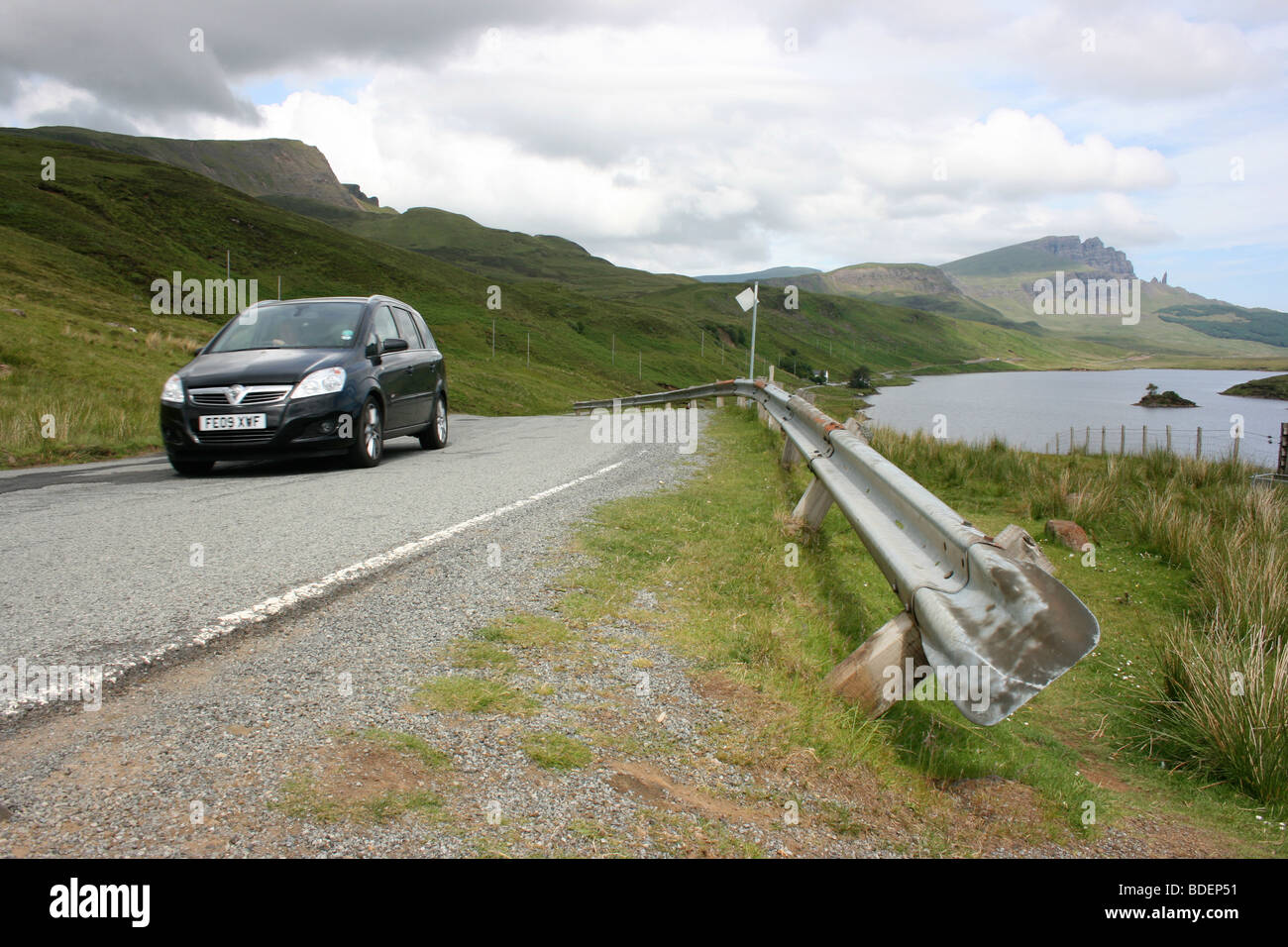 car travelling on the A855 next to Loch Fada on the Trotternish ...
