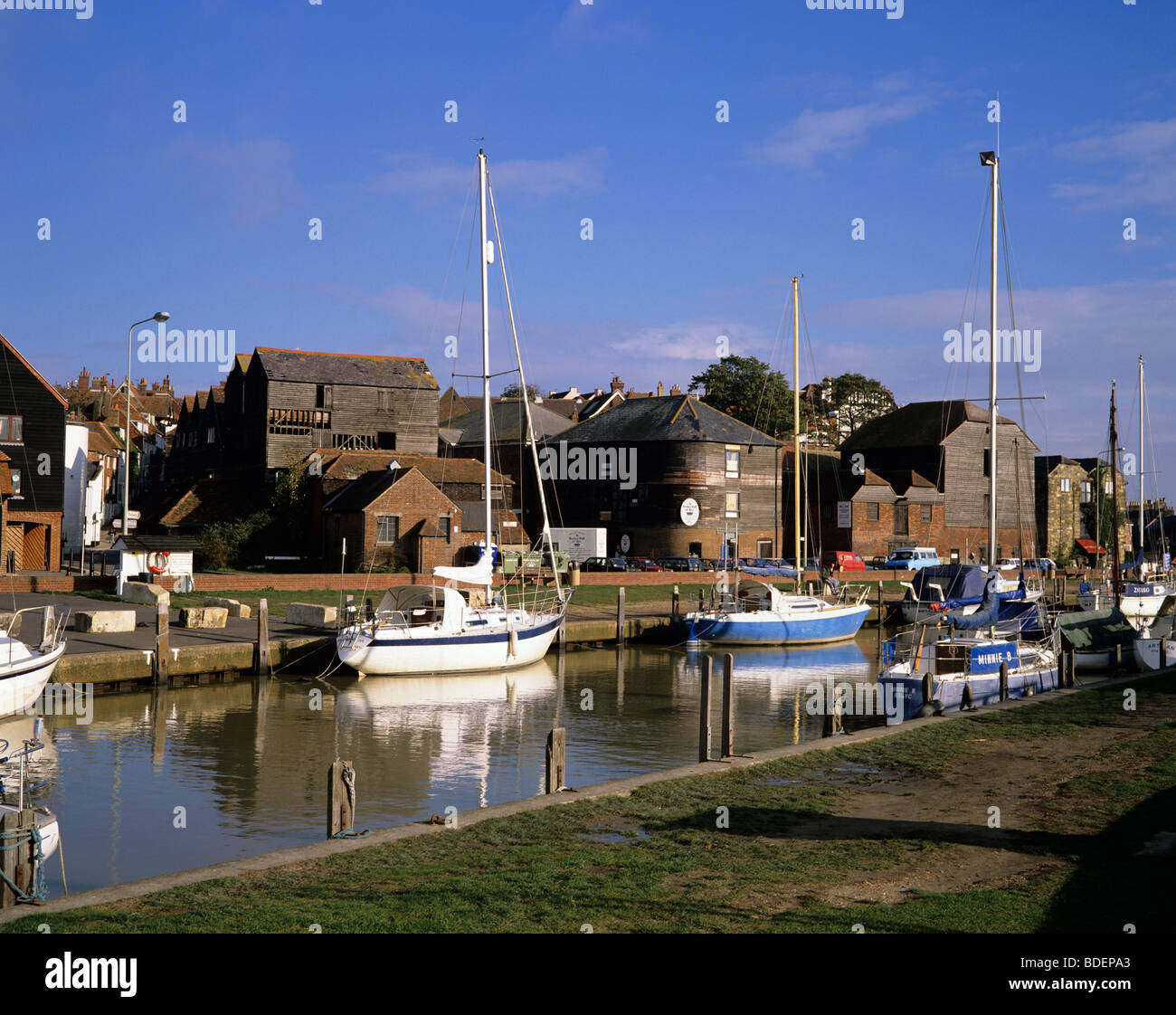 Boat moorings and old wooden buildings at the ancient Cinque Port of ...